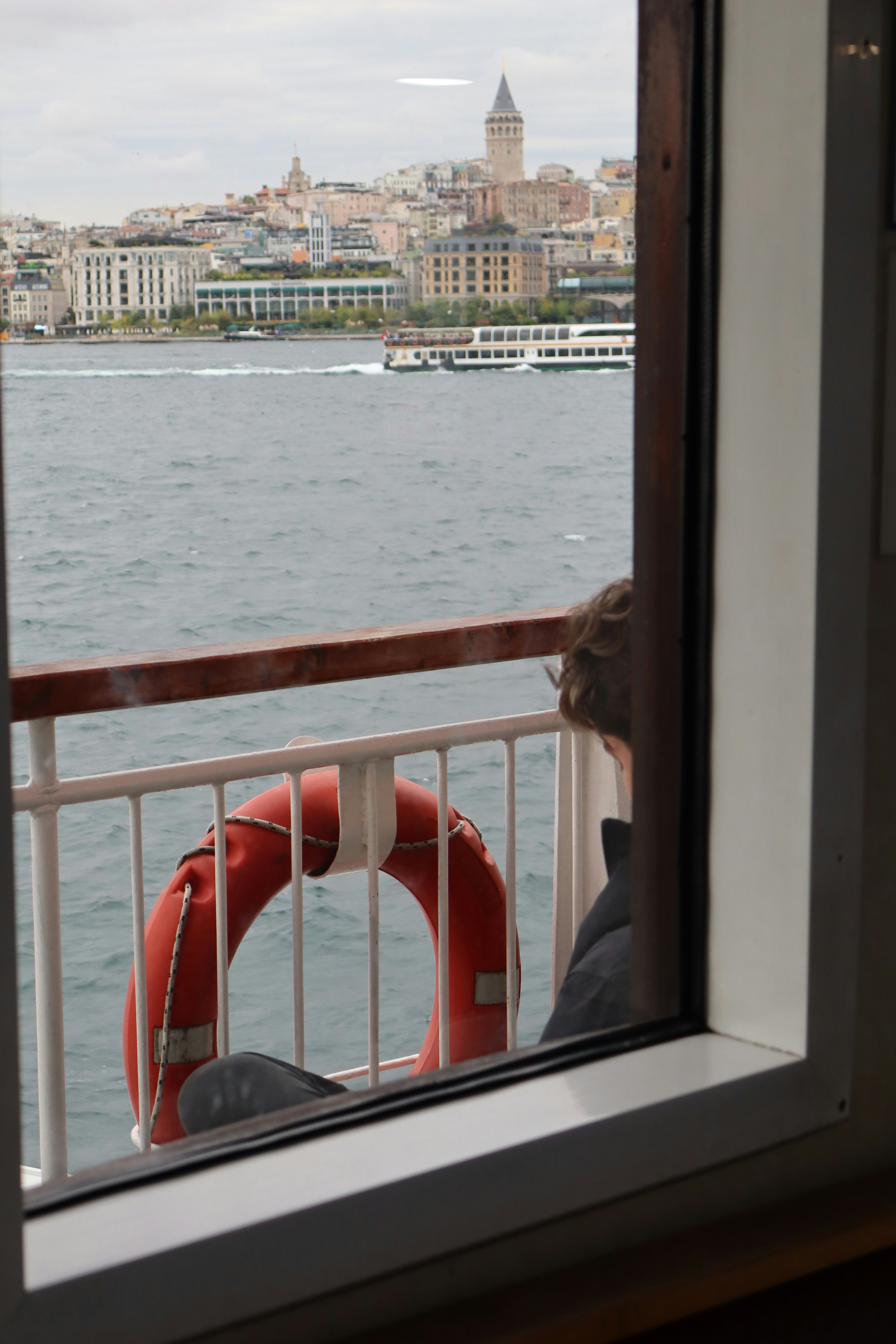 Window View Over the Bosphorus: A Quiet Moment on the Ferry
