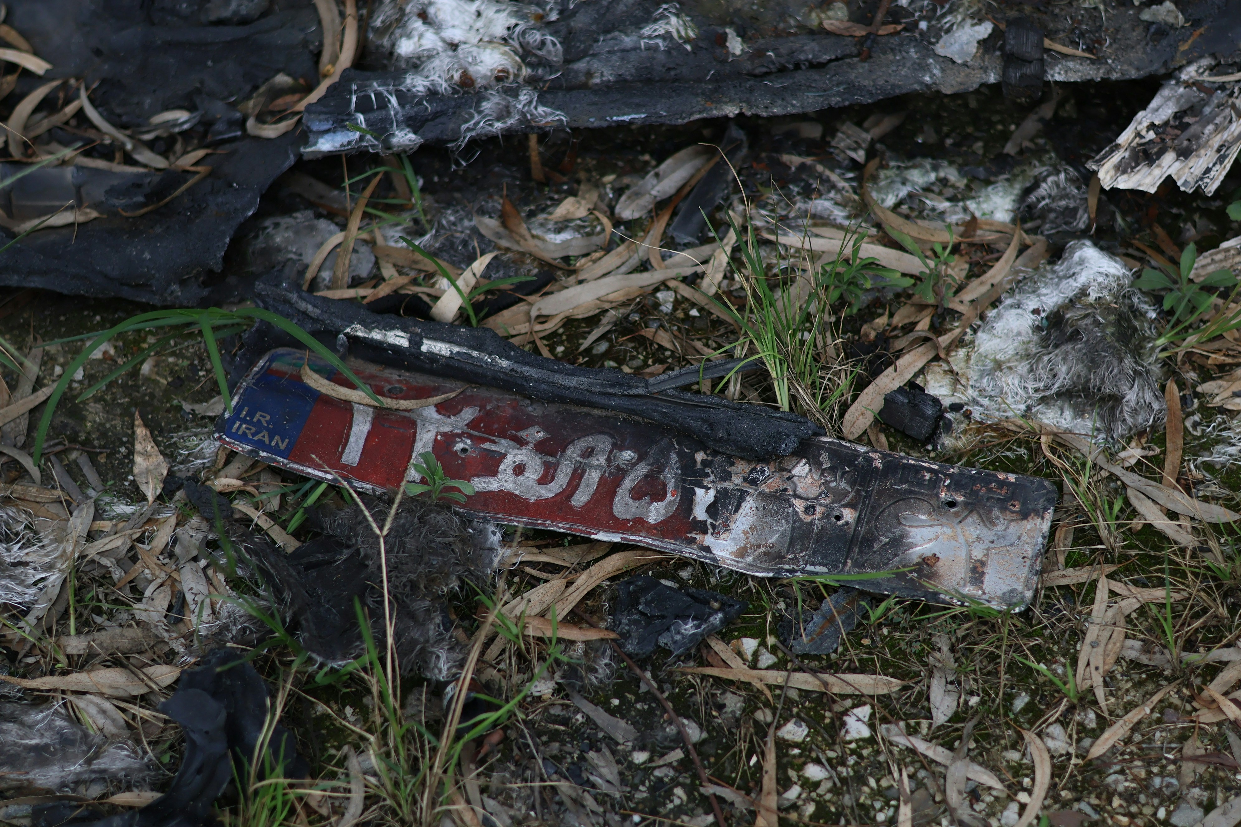 Charred Cigarette Pack Amid Debris: Echoes of a Forgotten Scene
