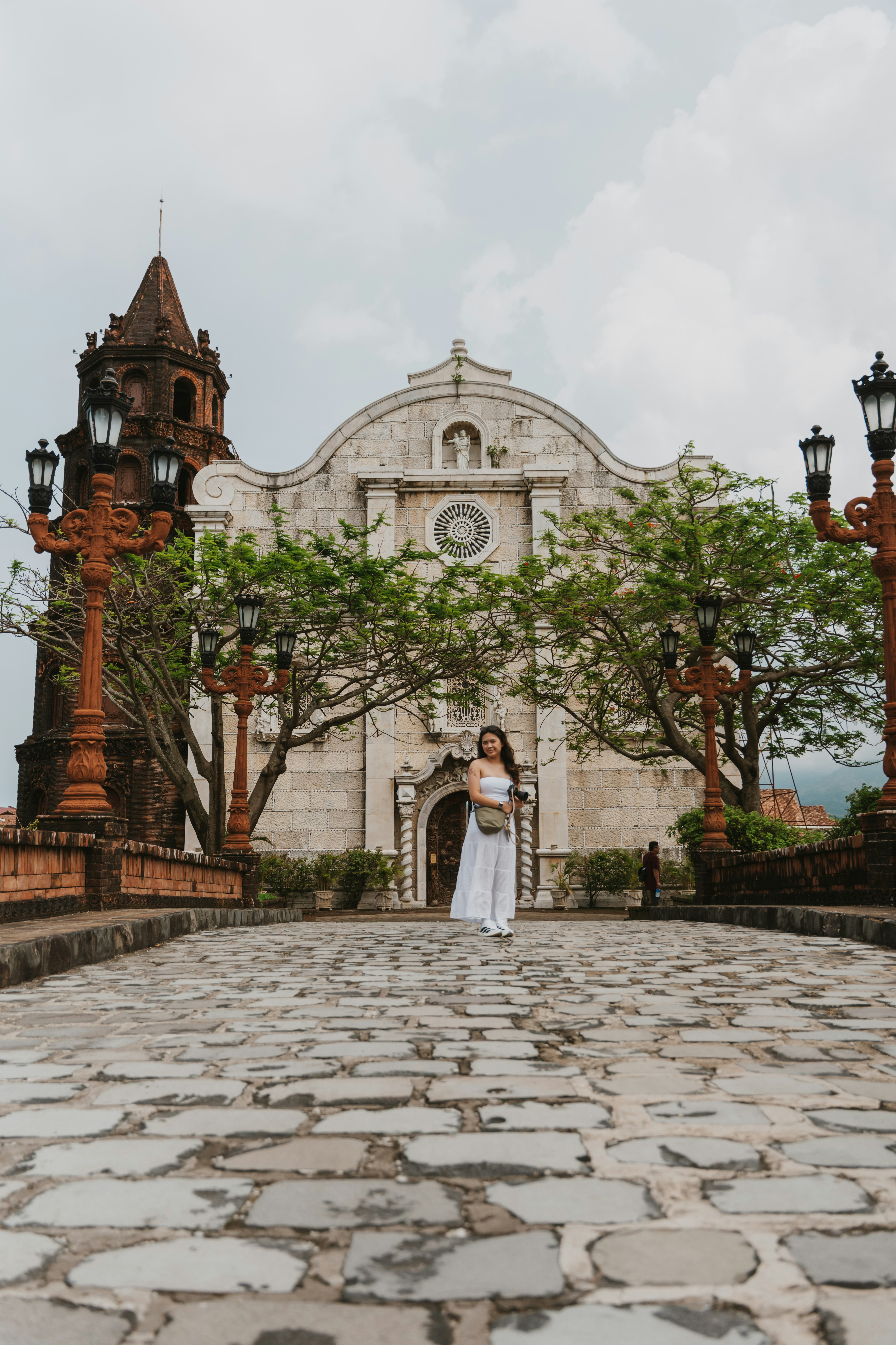 Bride in White Beneath the Archway of Historic Steps