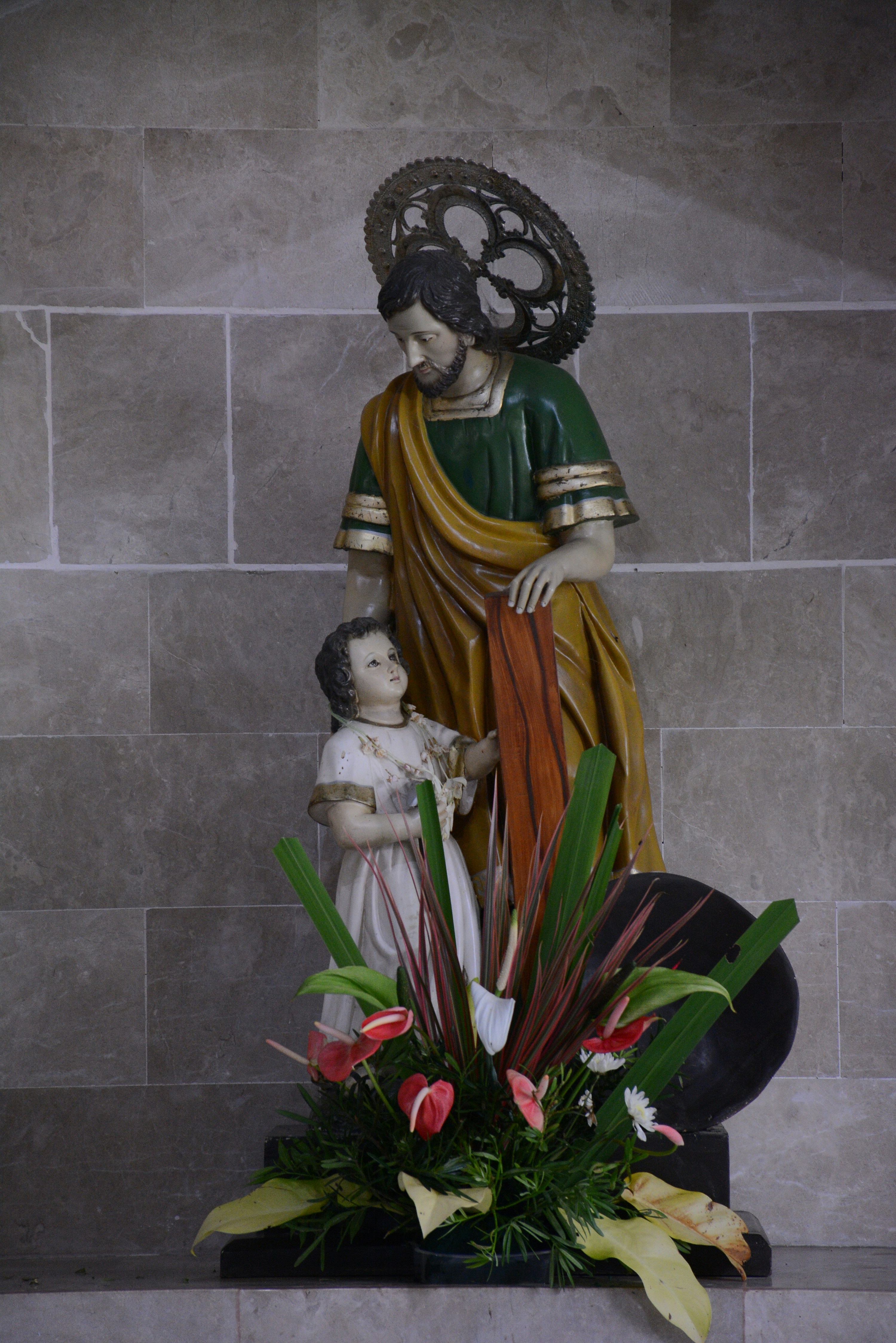 Haloed Carpenter’s Child: A Saintly Moment in Quiet Vase and Stone