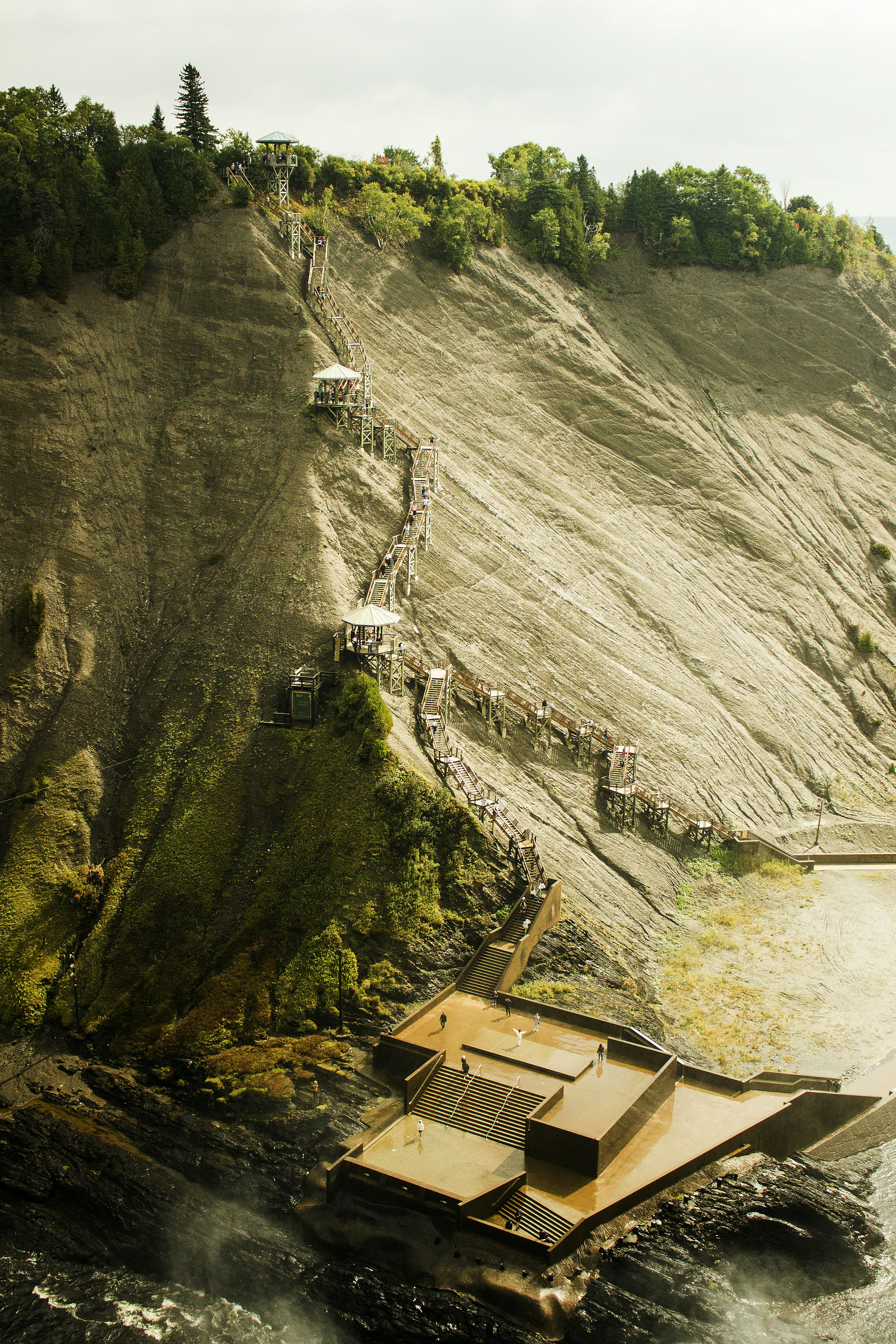 Staircase to the Sea: A Cliffside Ascent with a Terraced Platform