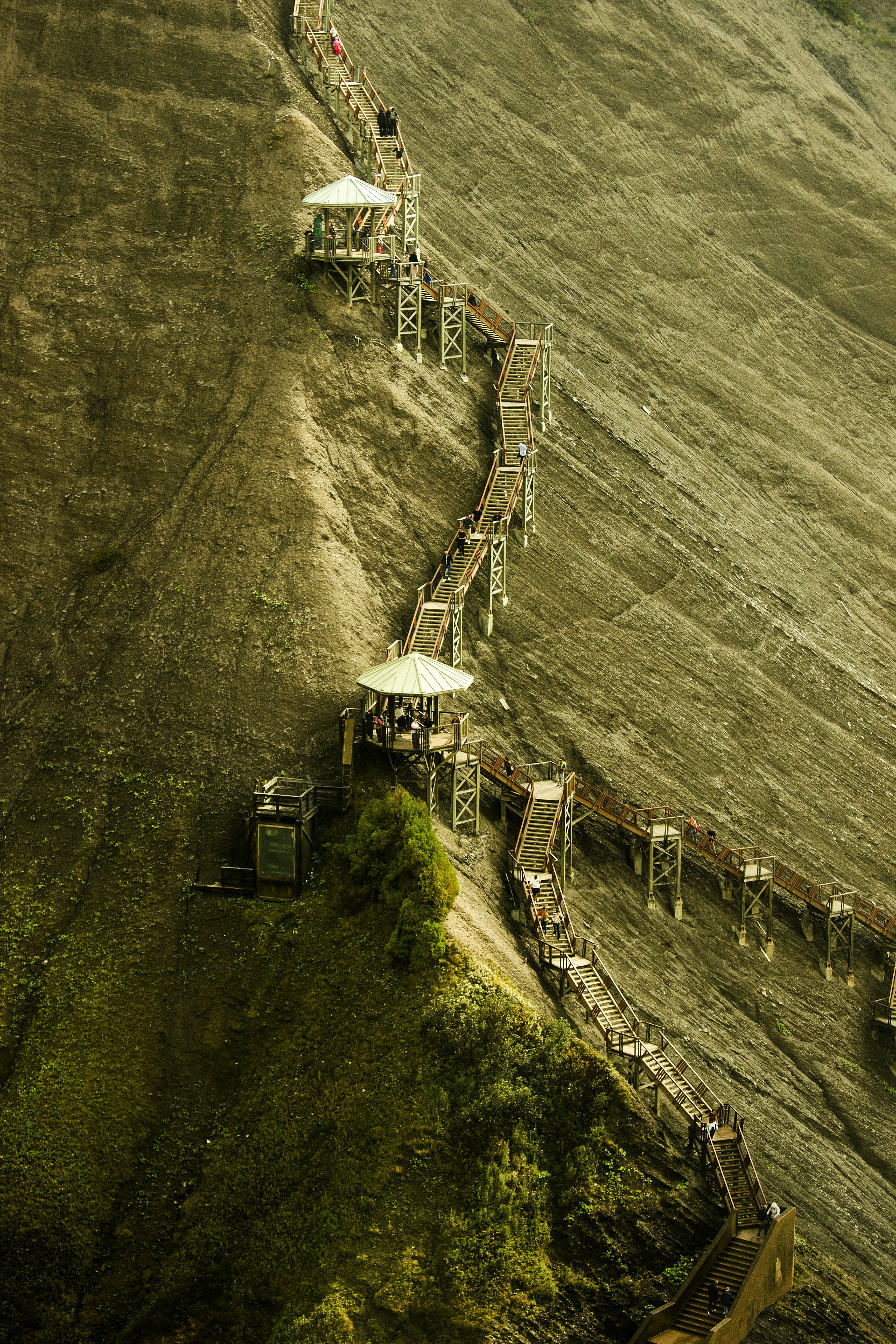 Winding wooden stairs cling to a steep hillside