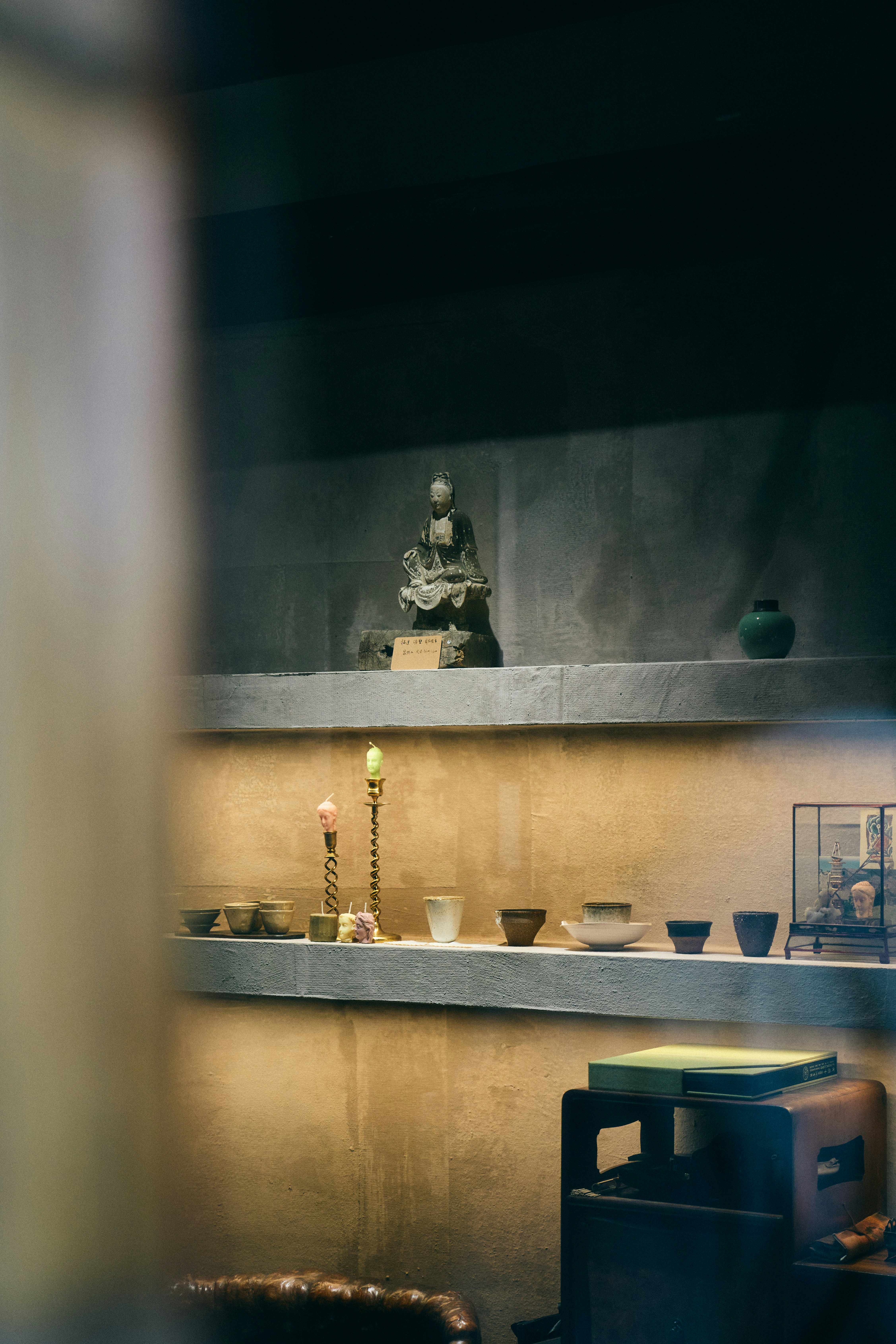 Quiet Shrine in a Dimly Lit Display Case