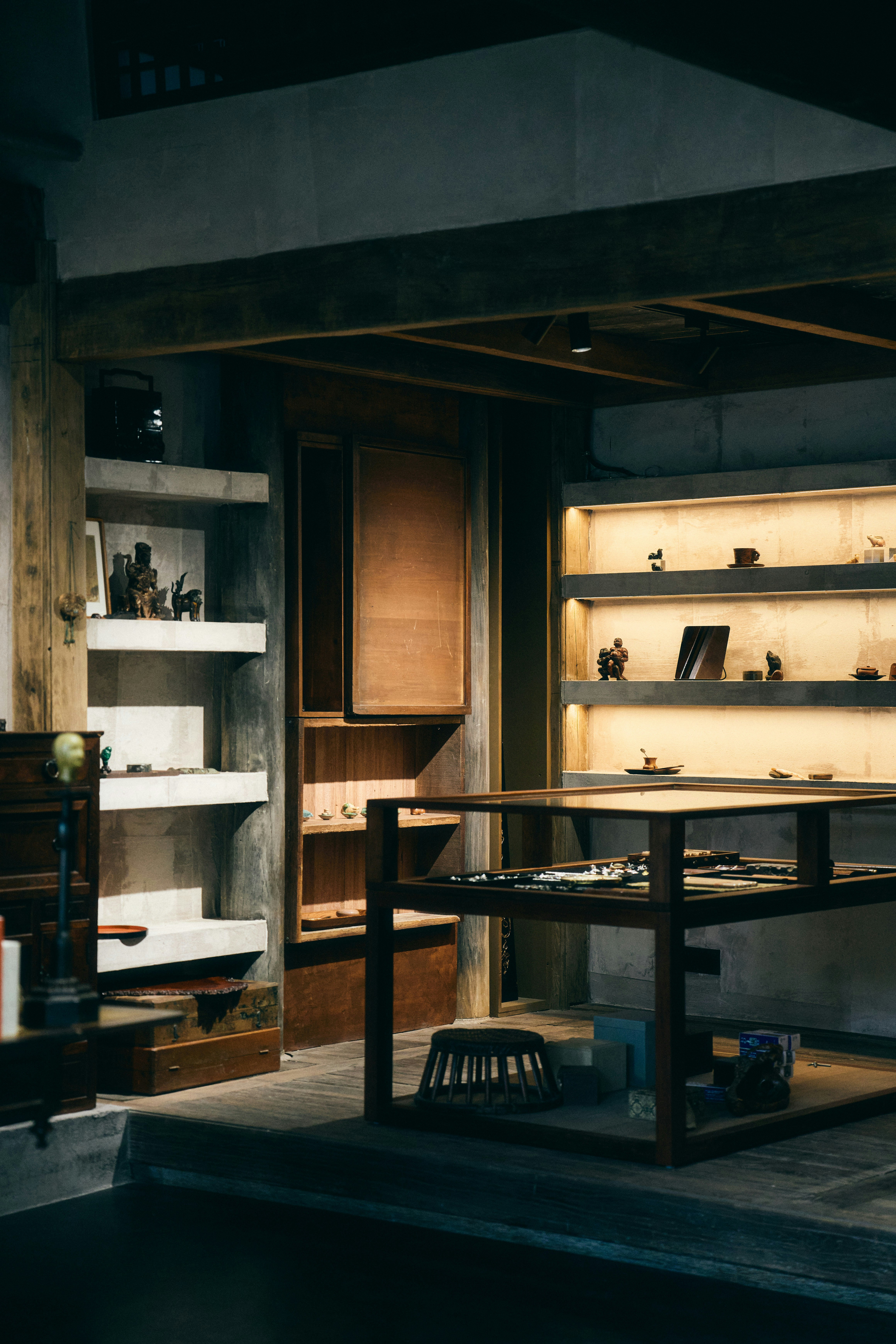Warmly Lit Display Table in a Minimalist Gallery