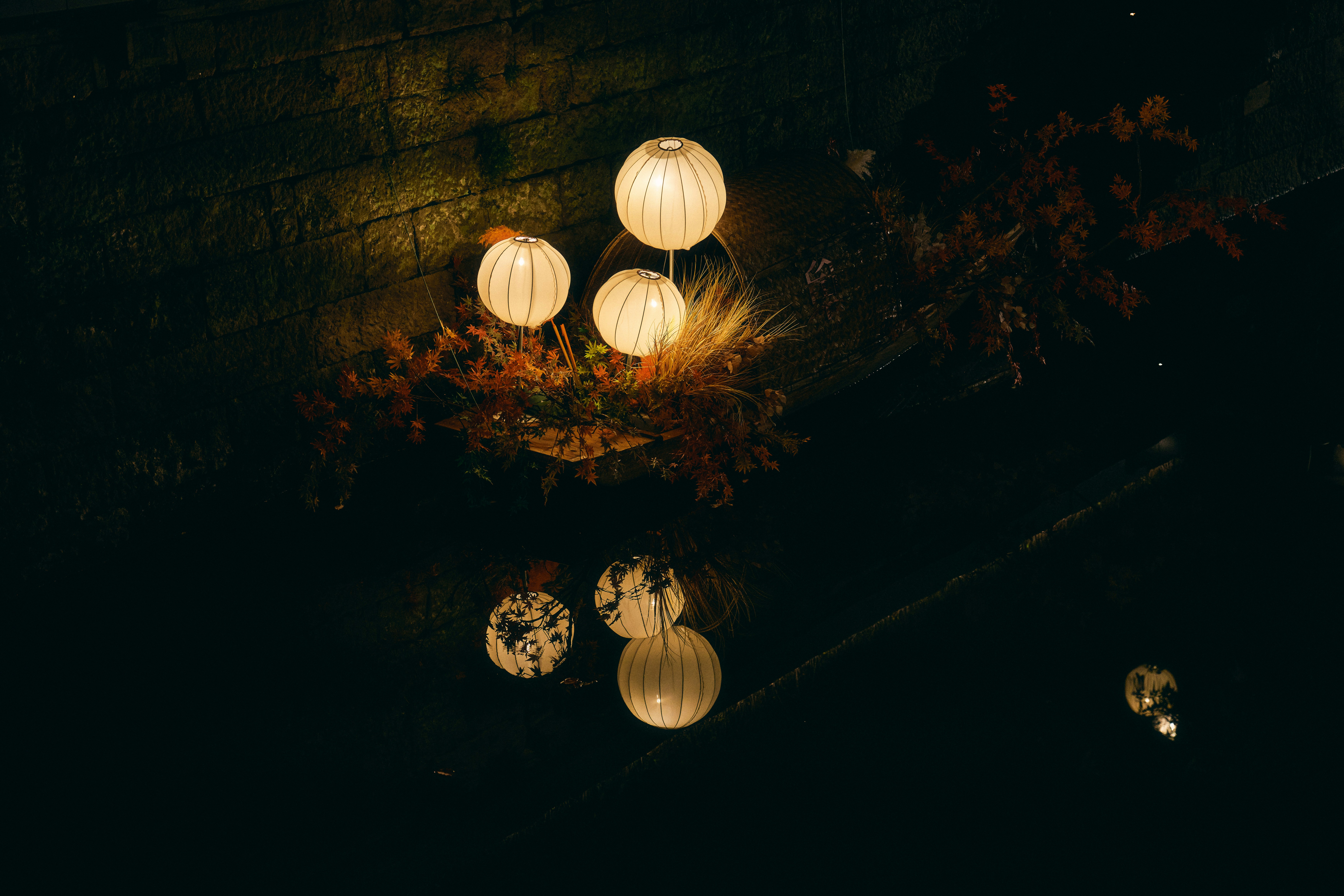 Moonlit lanterns on a quiet canal edge