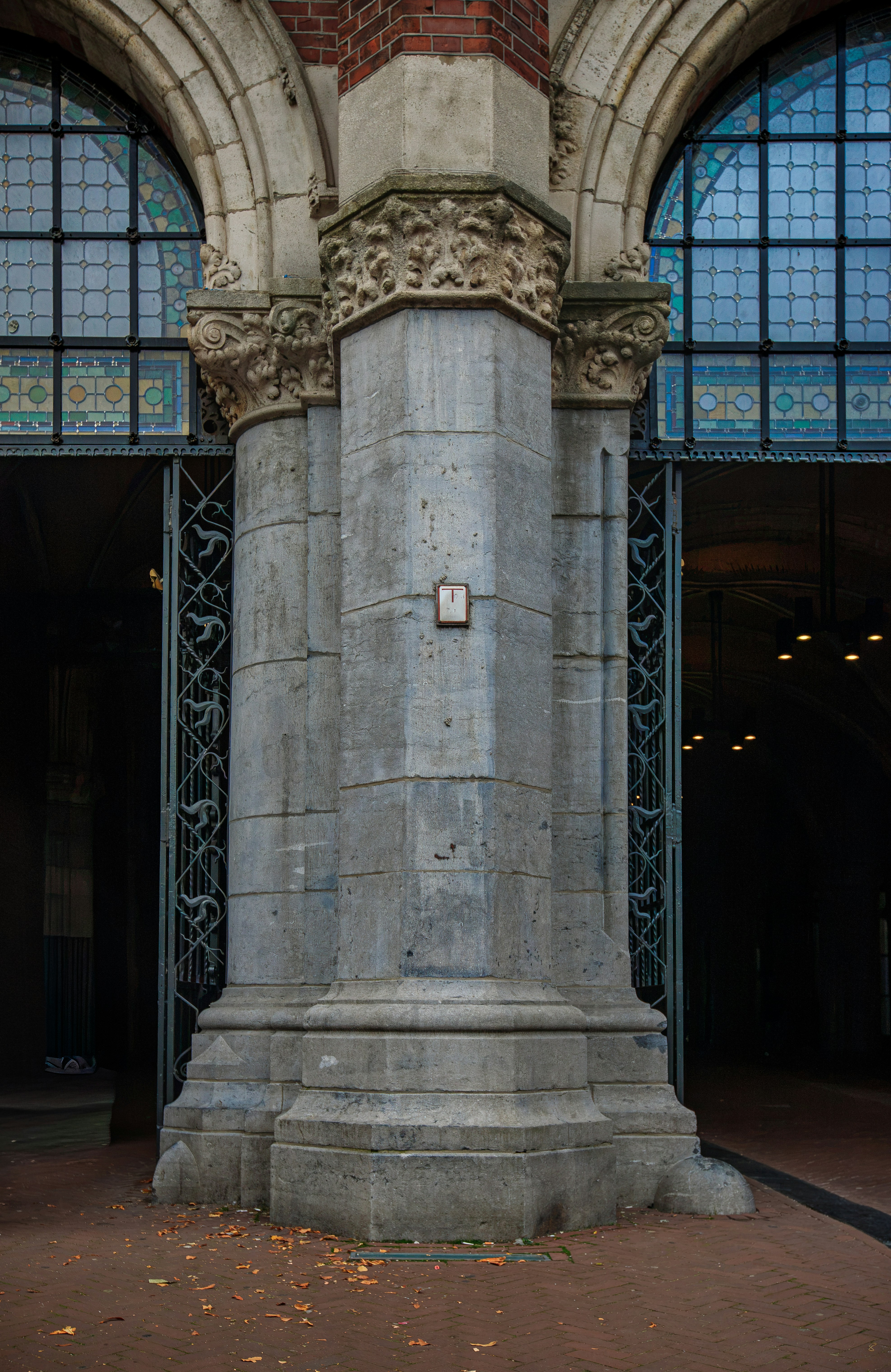 Stone Column Gateway Framing an Archway with Ironwork