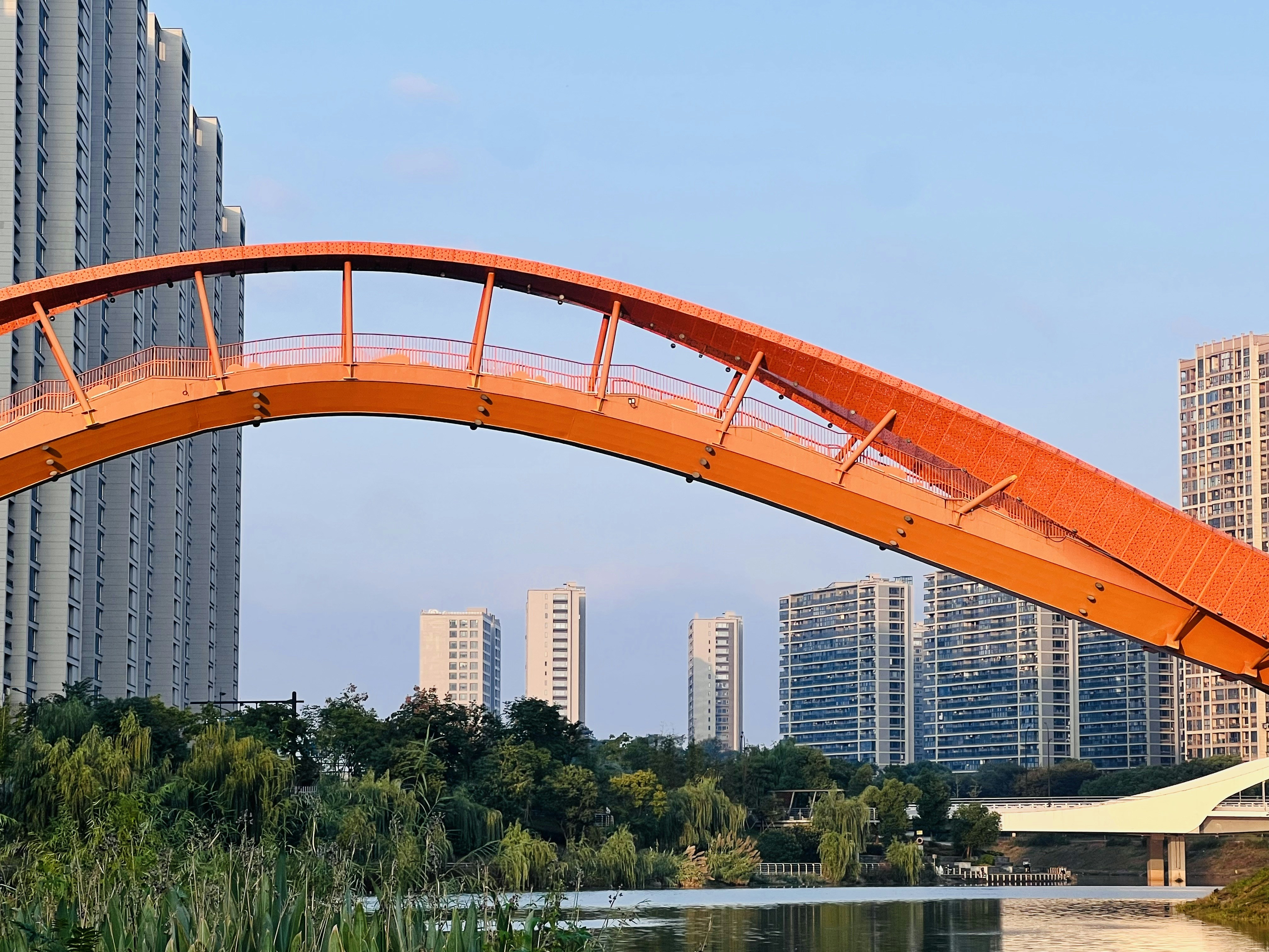 Arc of Orange: A Modern Riverside Crossing