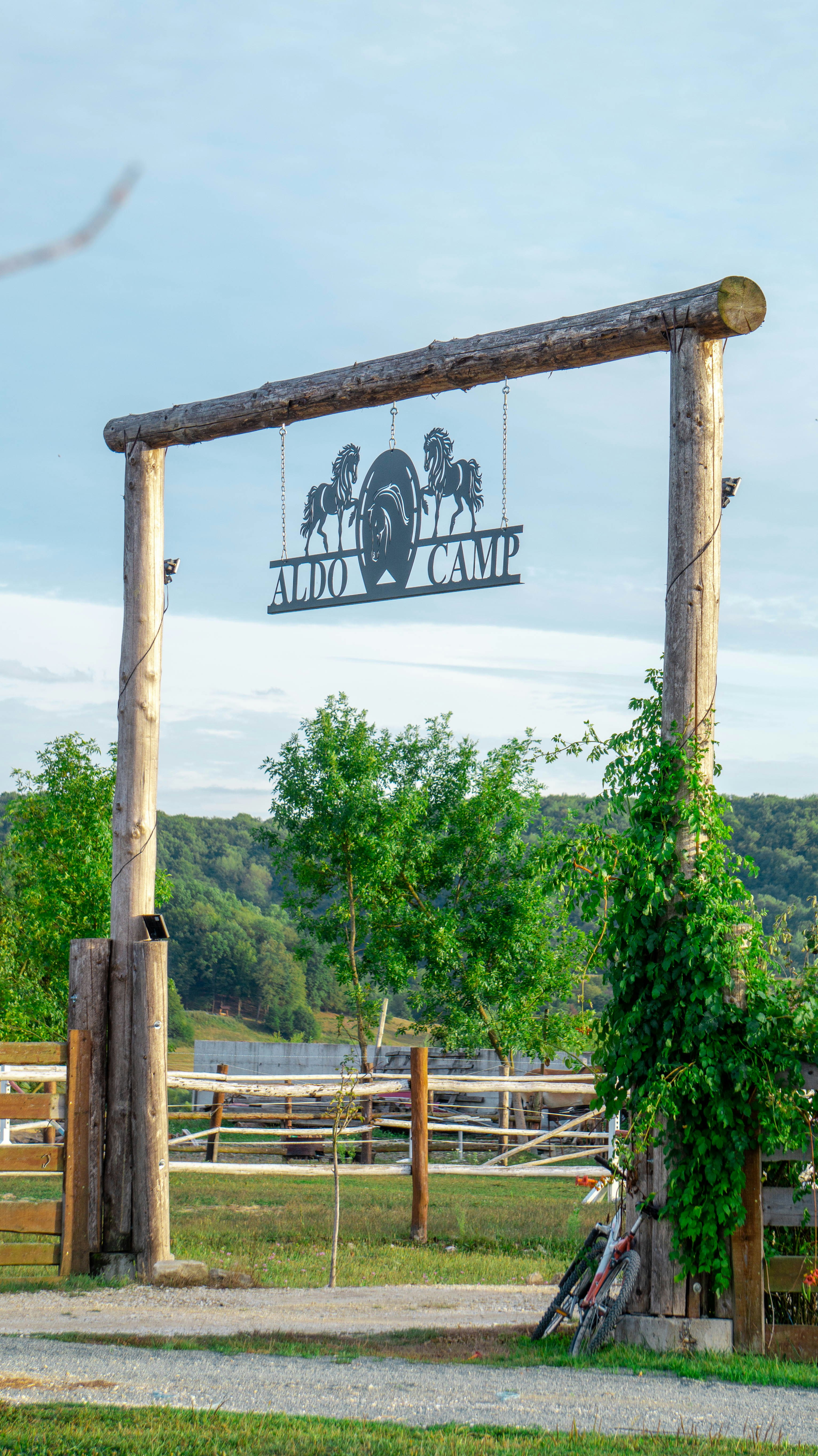 Gateway to the Camp: A Rustic Sign Framed by Cedar Posts