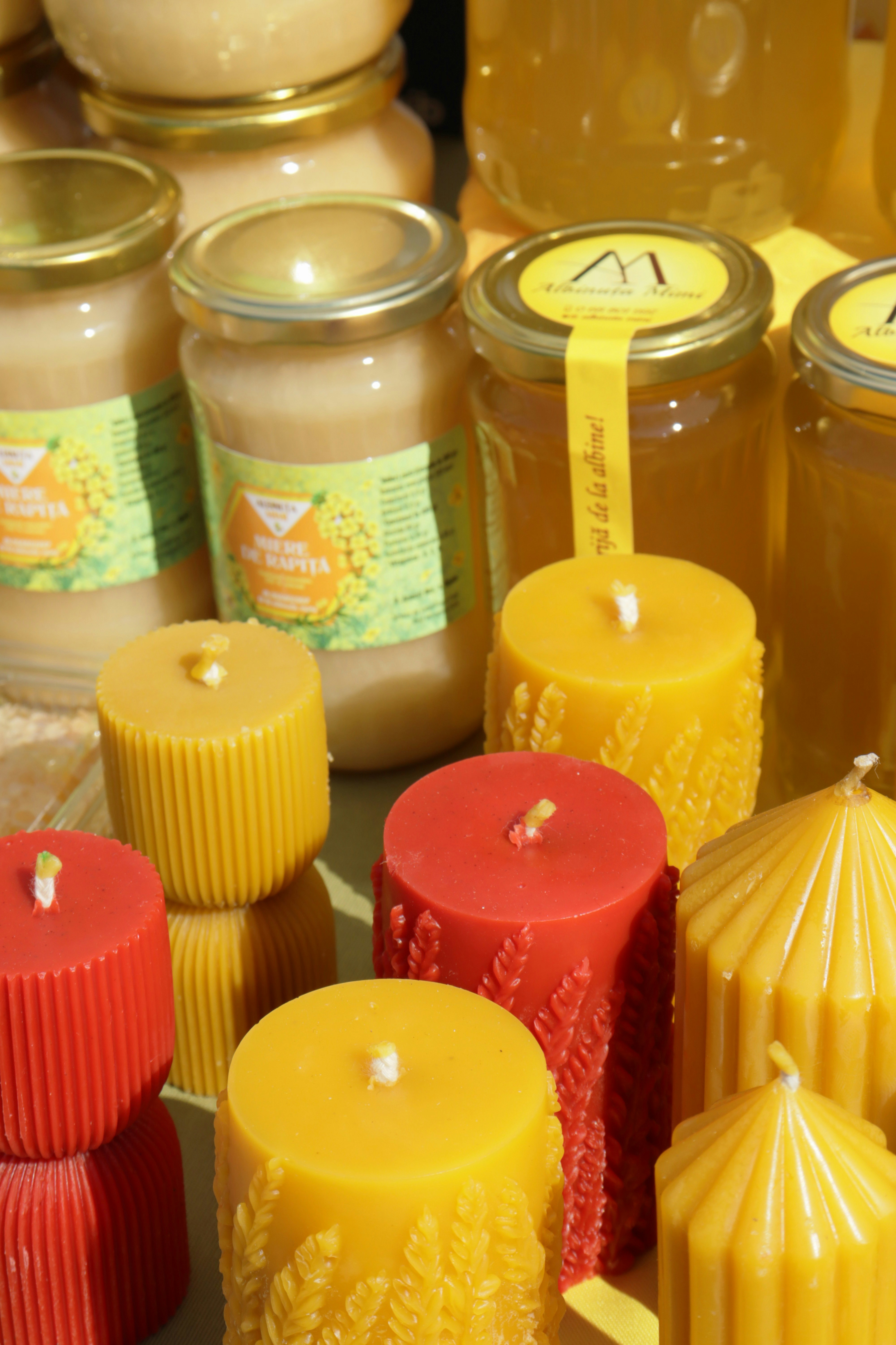 Sunlit Beeswax: A Palette of Candles and Honey Jars