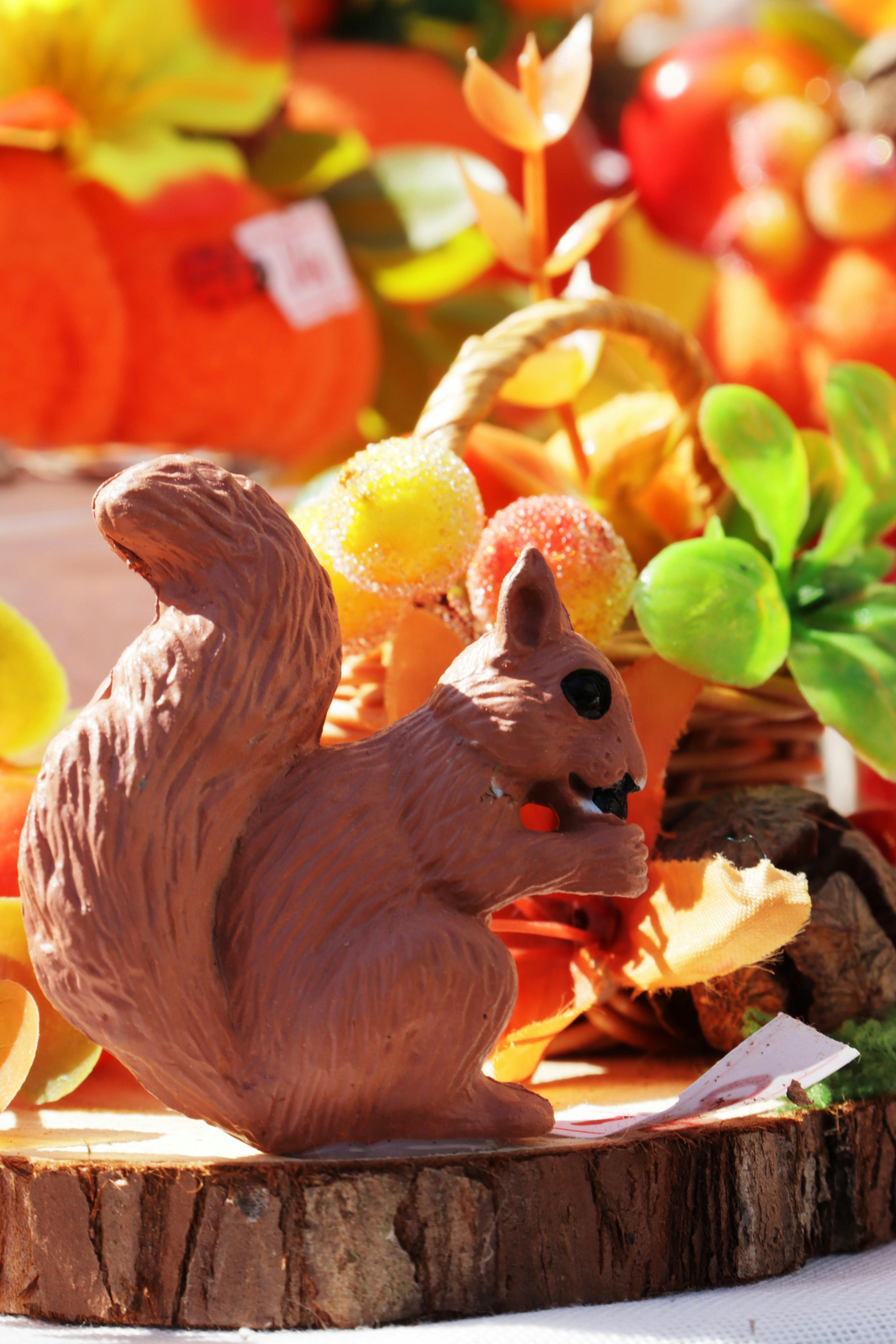 Nutty Squirrel Snack: A Playful Carved Acrobat Amid Autumn Treats