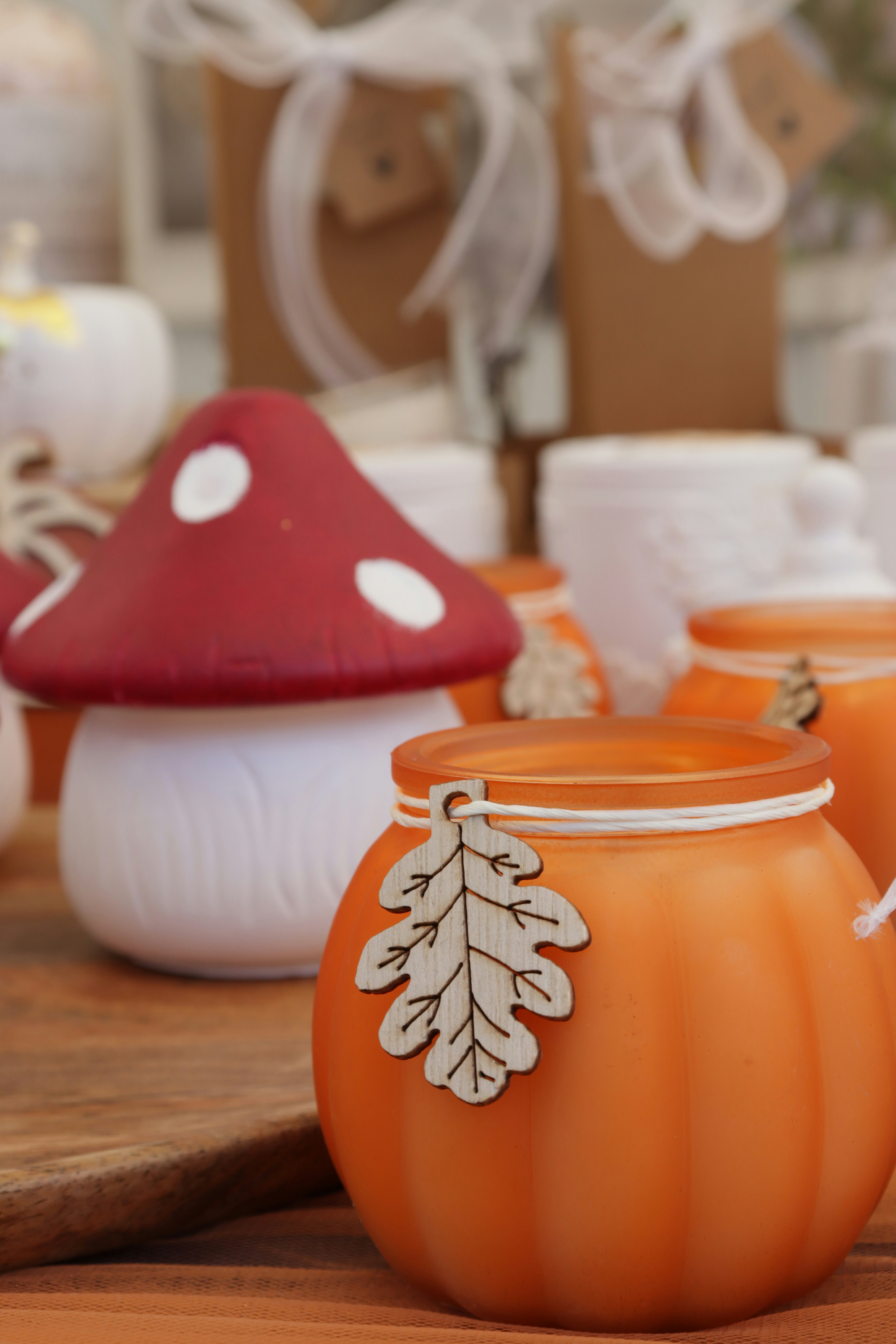 Orange Lanterns and a Red Mushroom: A Cozy Autumn Tabletop Scene