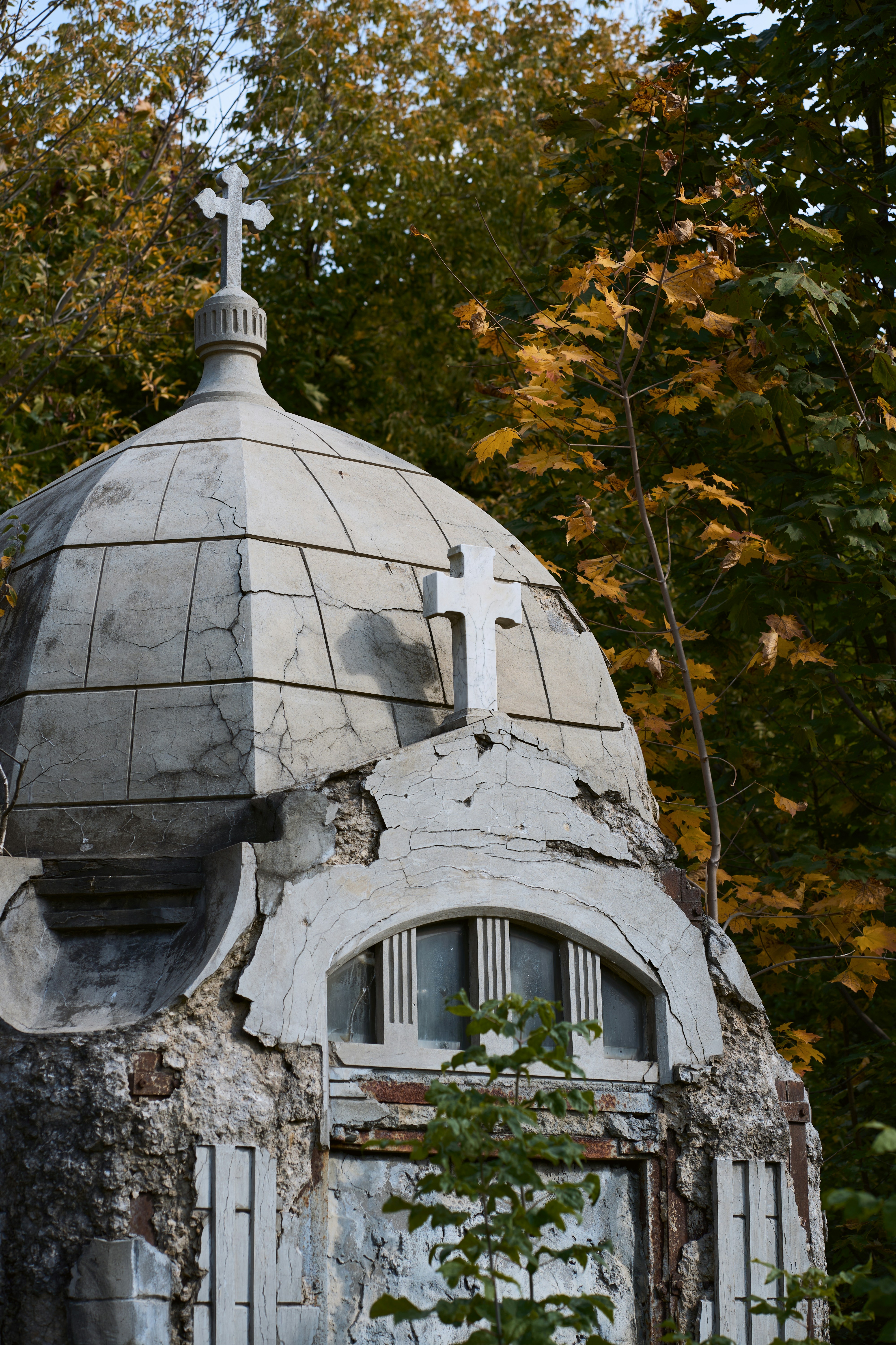 Weathered Orthodox Dome Among Autumn Leaves