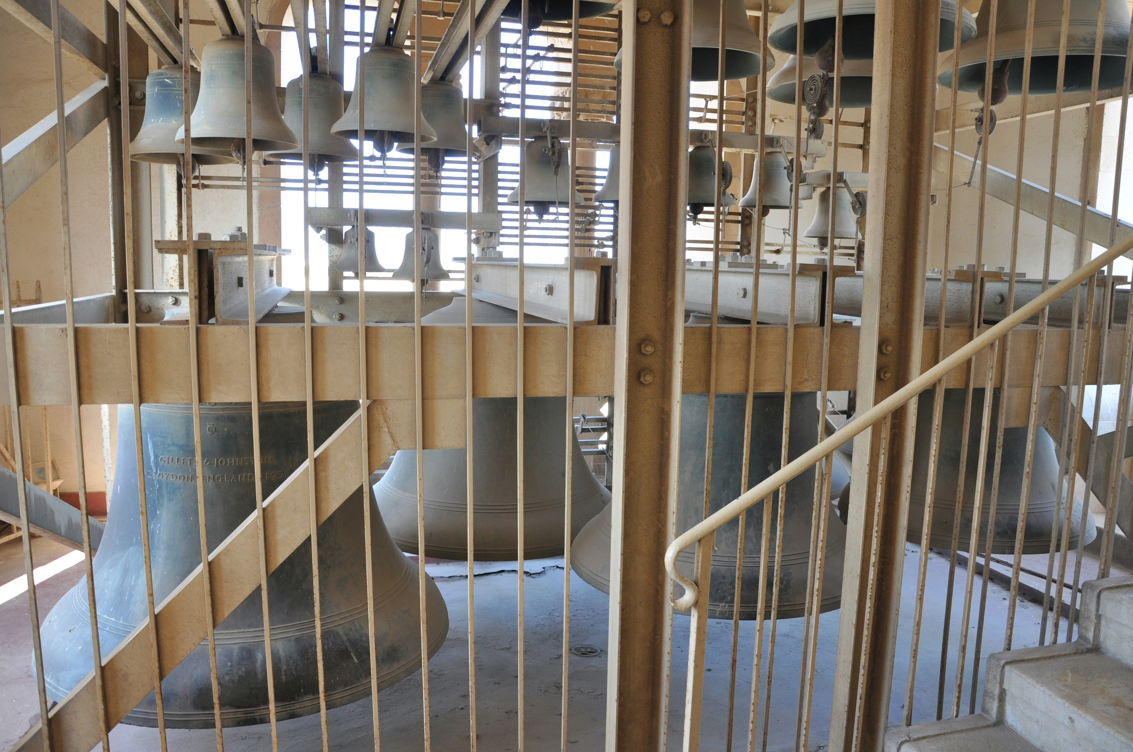 Overhead bells and cage: a glimpse inside a bell-tower workshop