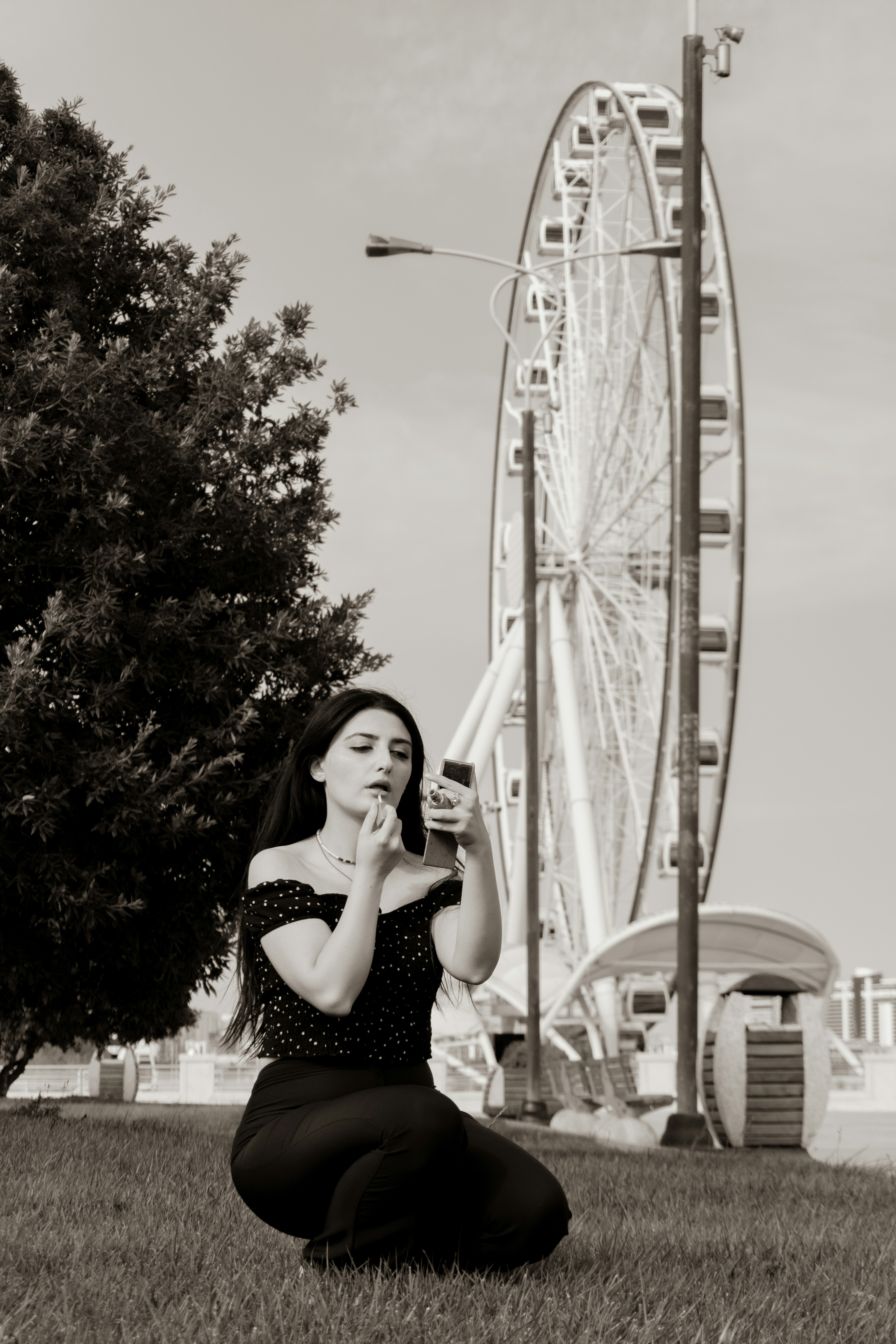 Portrait in the Park: A Quiet Moment by the Wheel