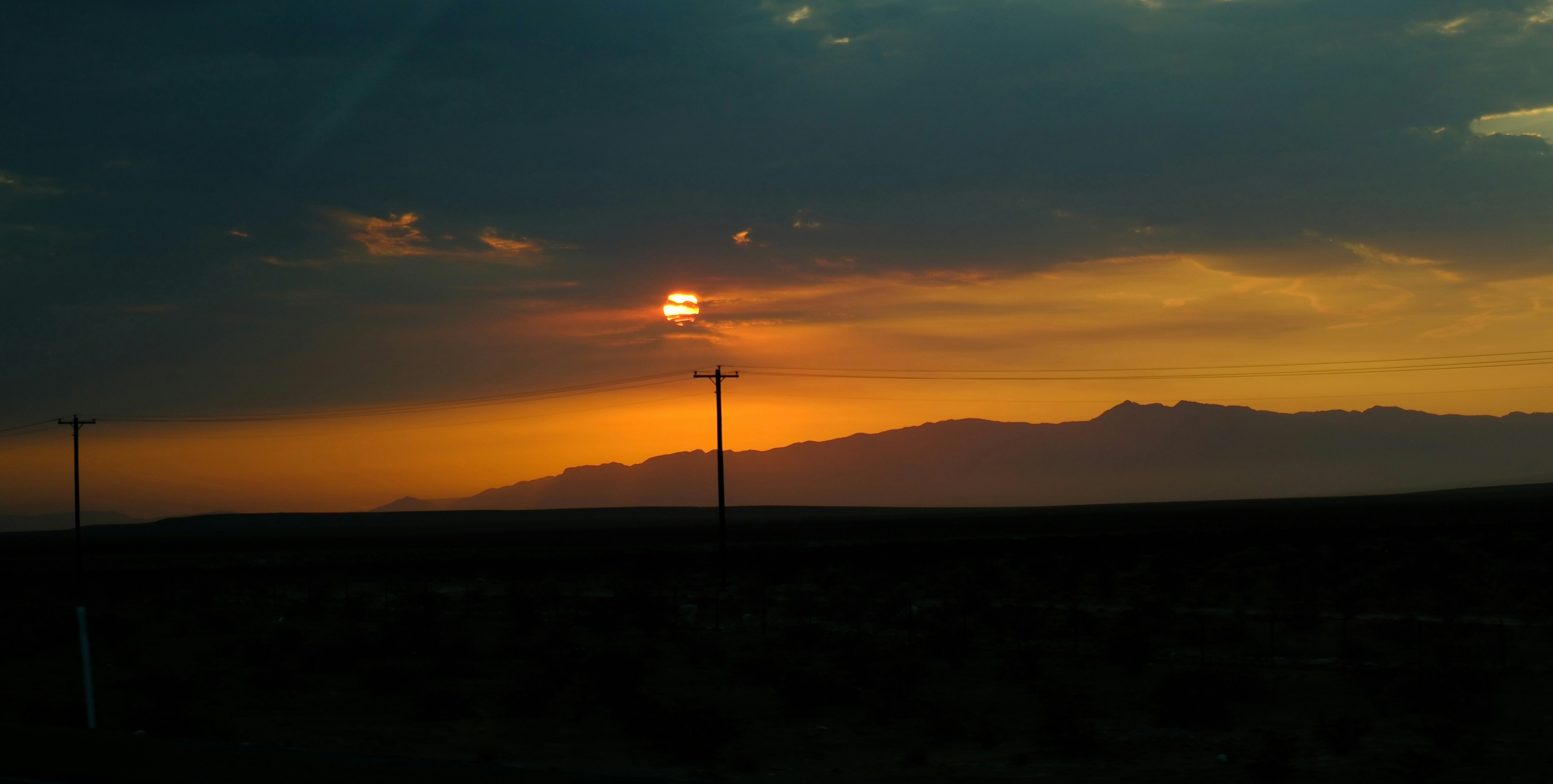 Silhouette at Sunset: Quiet Horizon Under a Glowing Sky