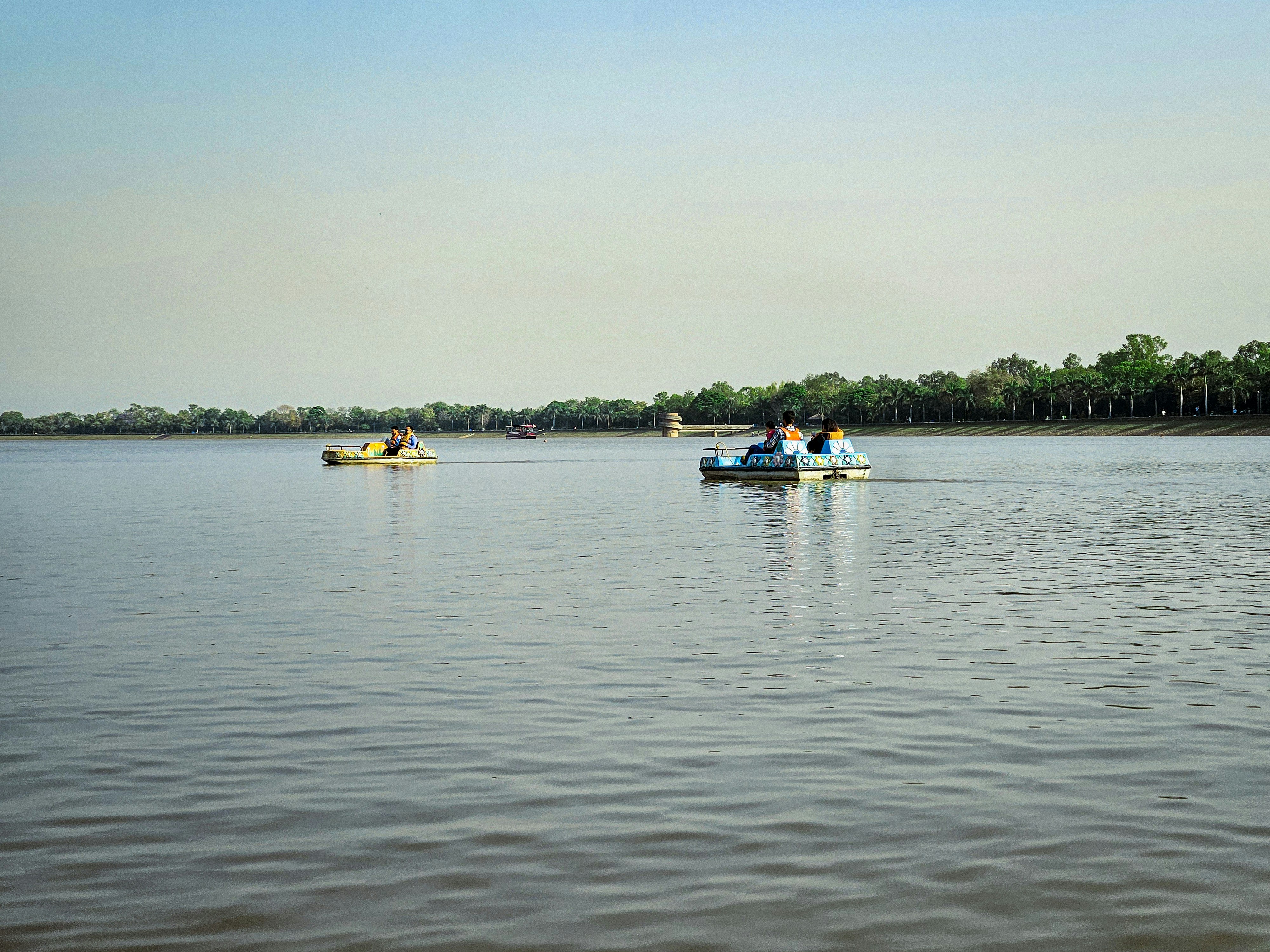 Two Boats On a Tranquil River: A Quiet Daylight Scene