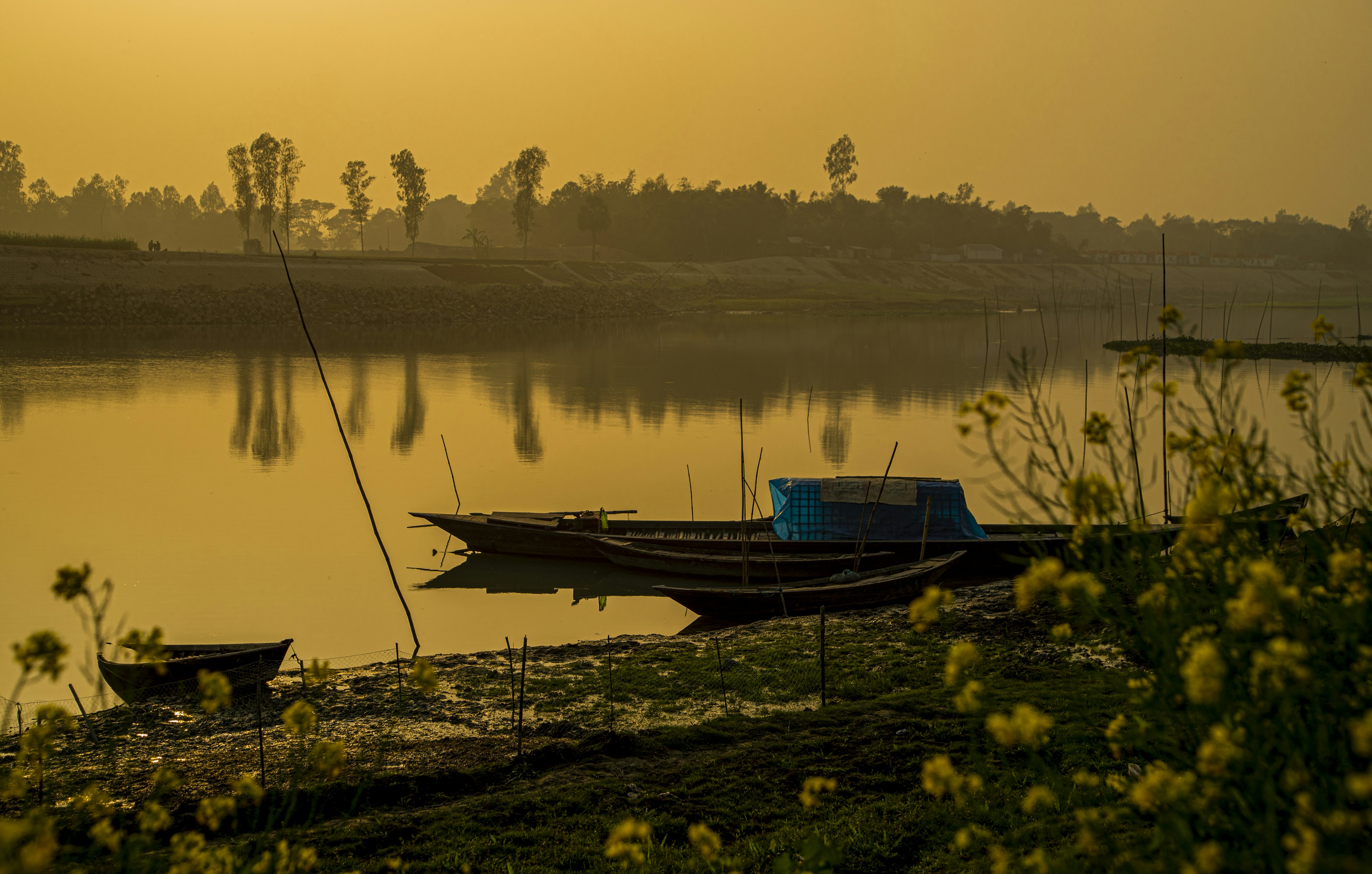 Amber Silence: Boats Rest at Sunset on a Calm River