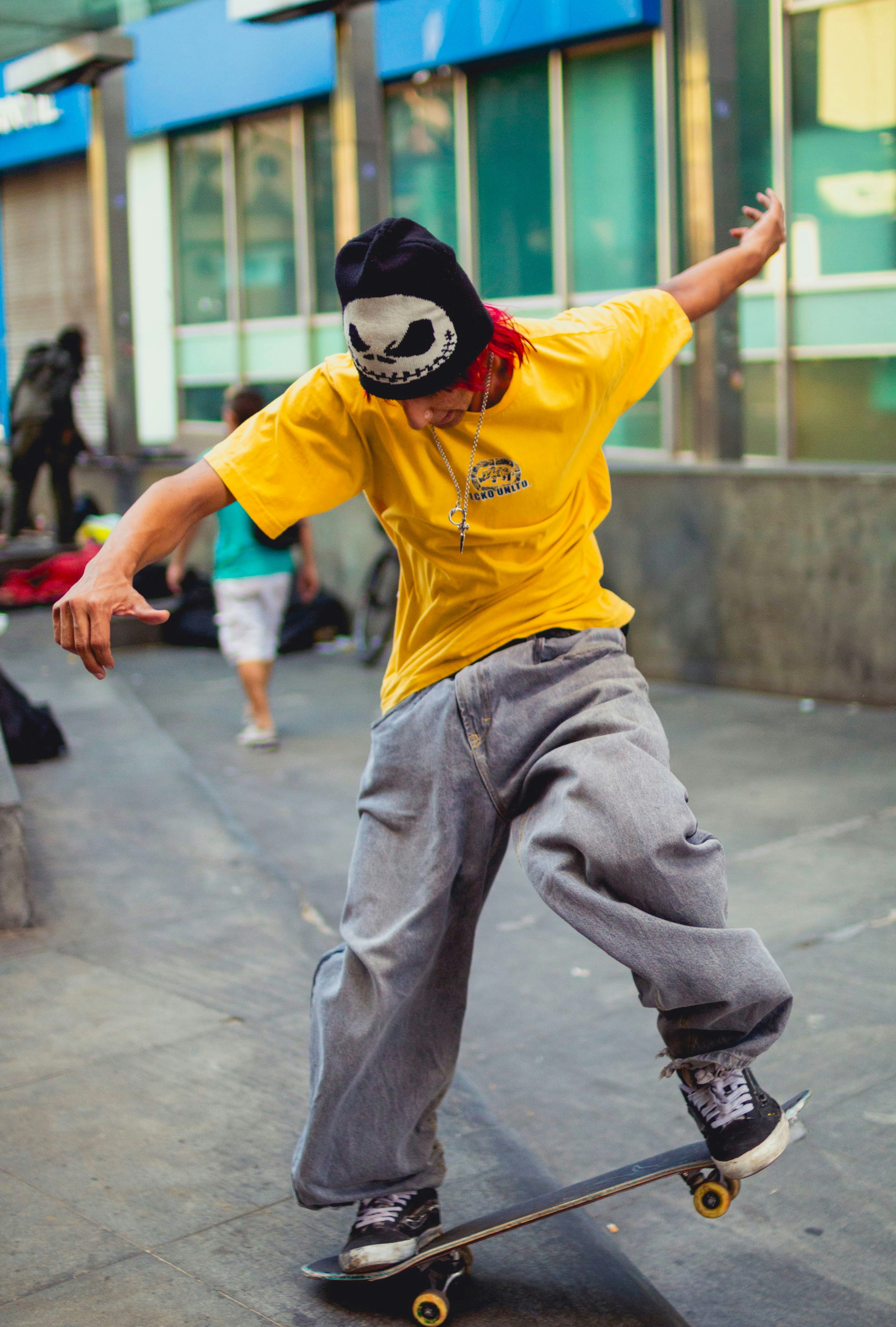 Skateboarder in a Burst of Yellow: A Dynamic Street Ride