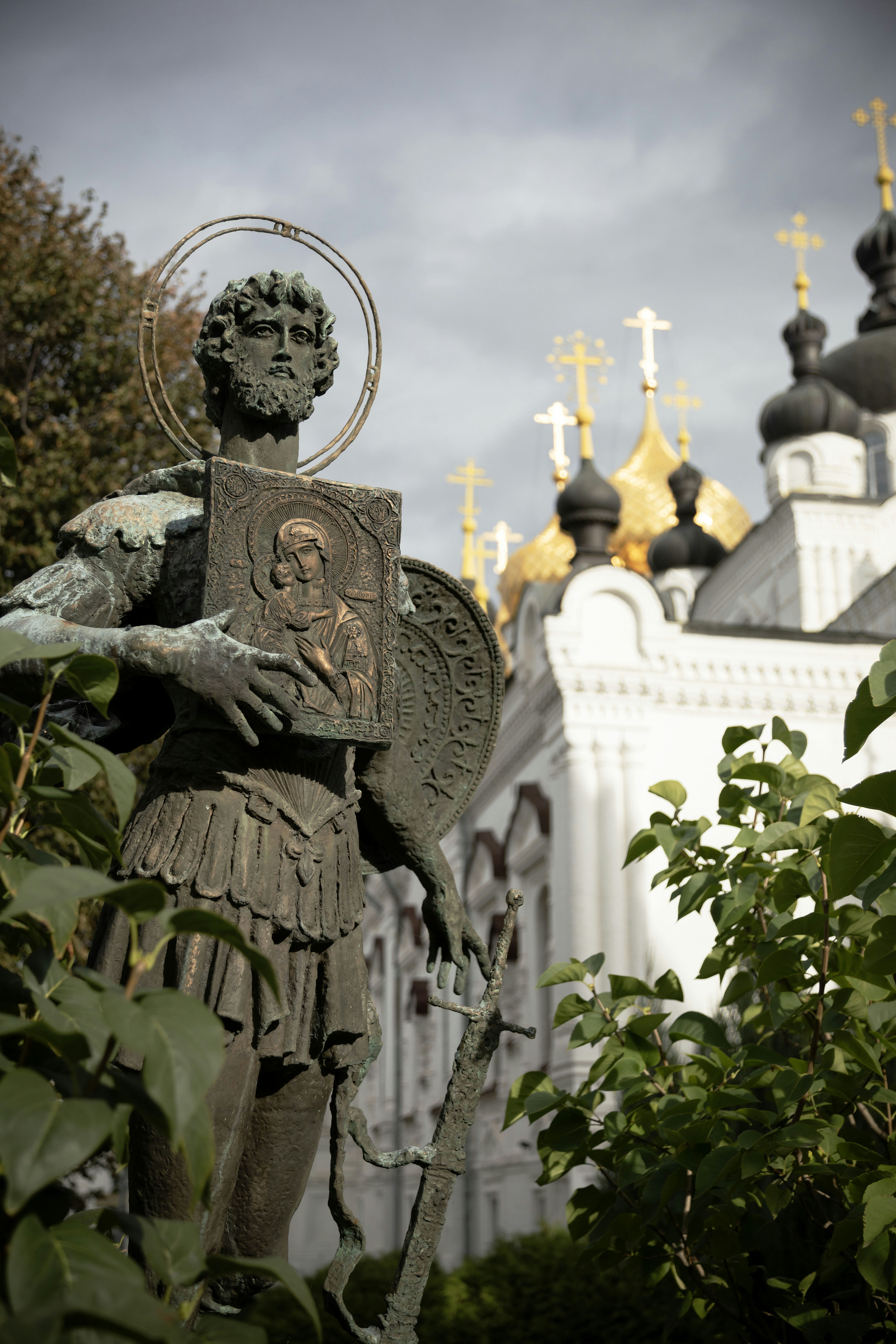 Saintly Sentinel: Metal Angel with Iconic Halo at a Russian Orthodox Monastic Complex