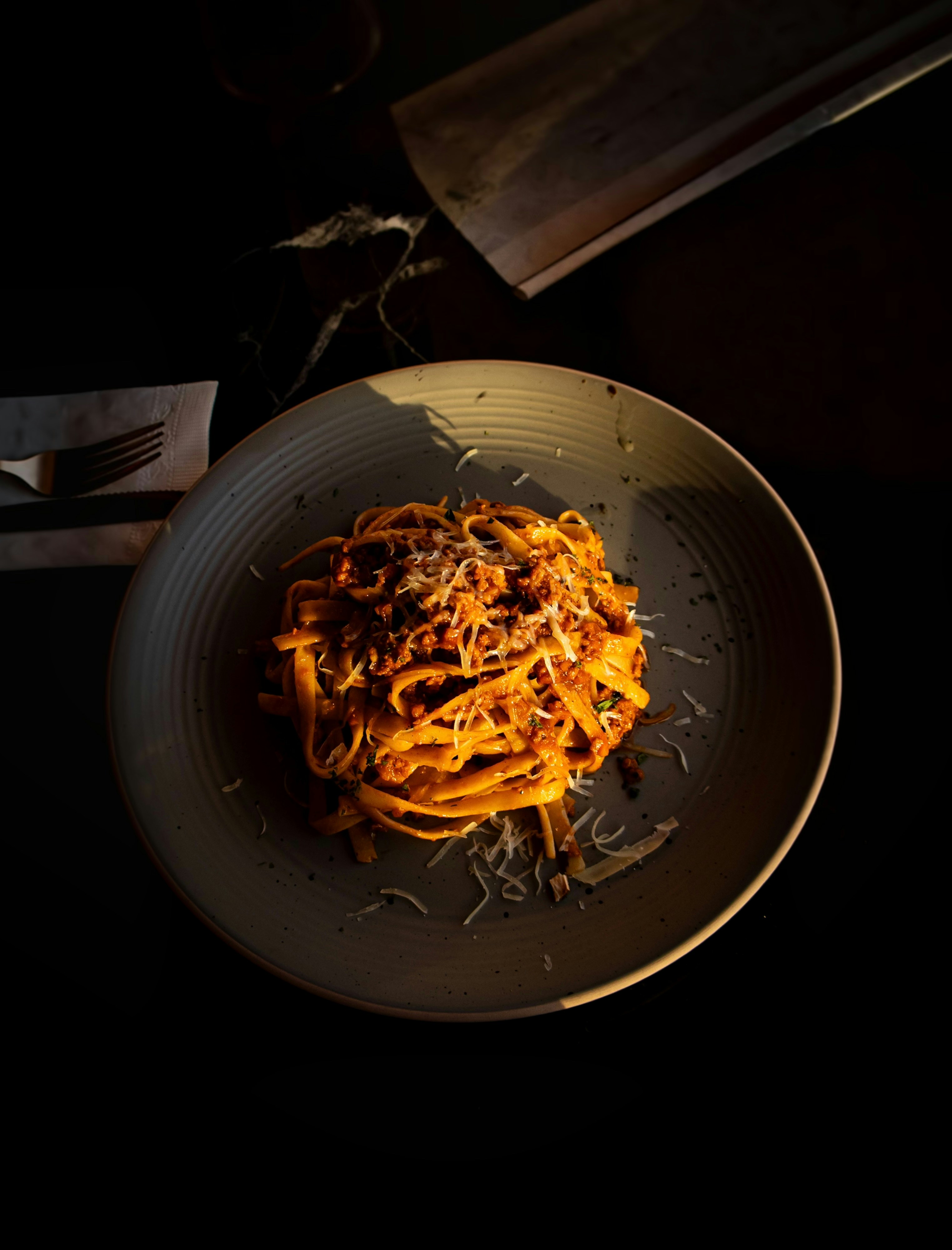Verdant Pasta Summit: A Plate Centered in Focus