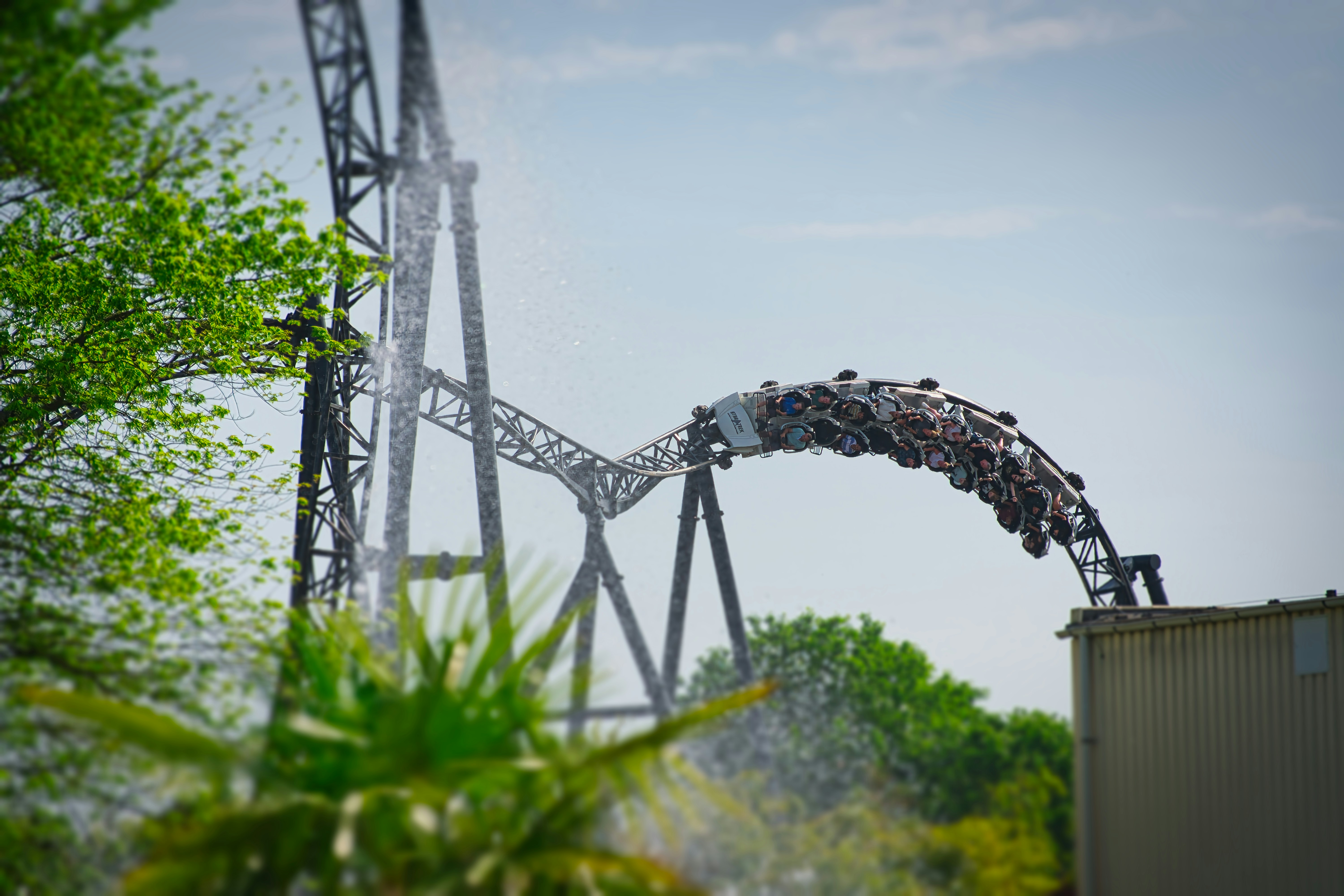 Cyclone of Steel: A Row of Cars Curl Over the Loop