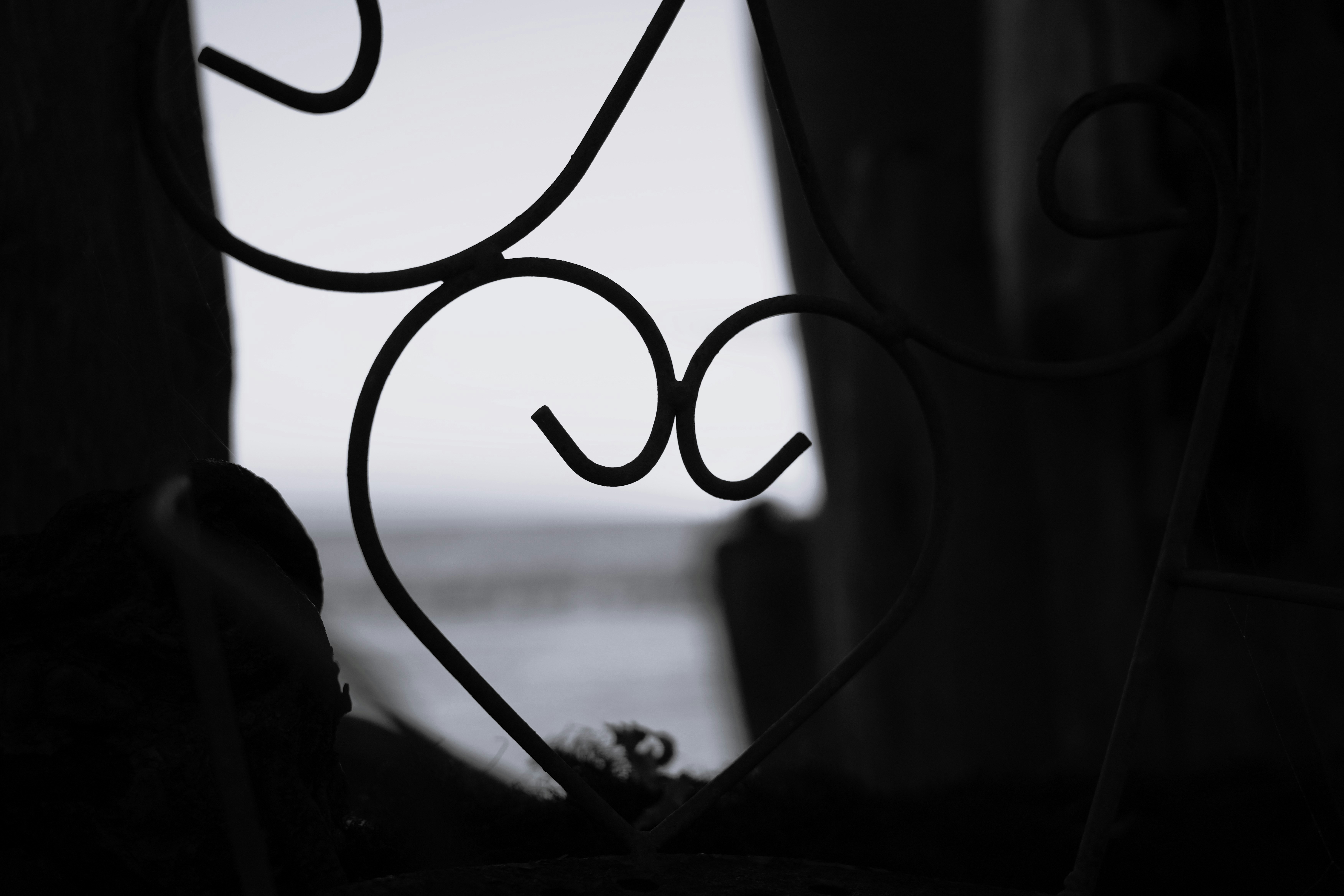 Shadowed Heartframe: Mysterious View Through Wrought Iron
