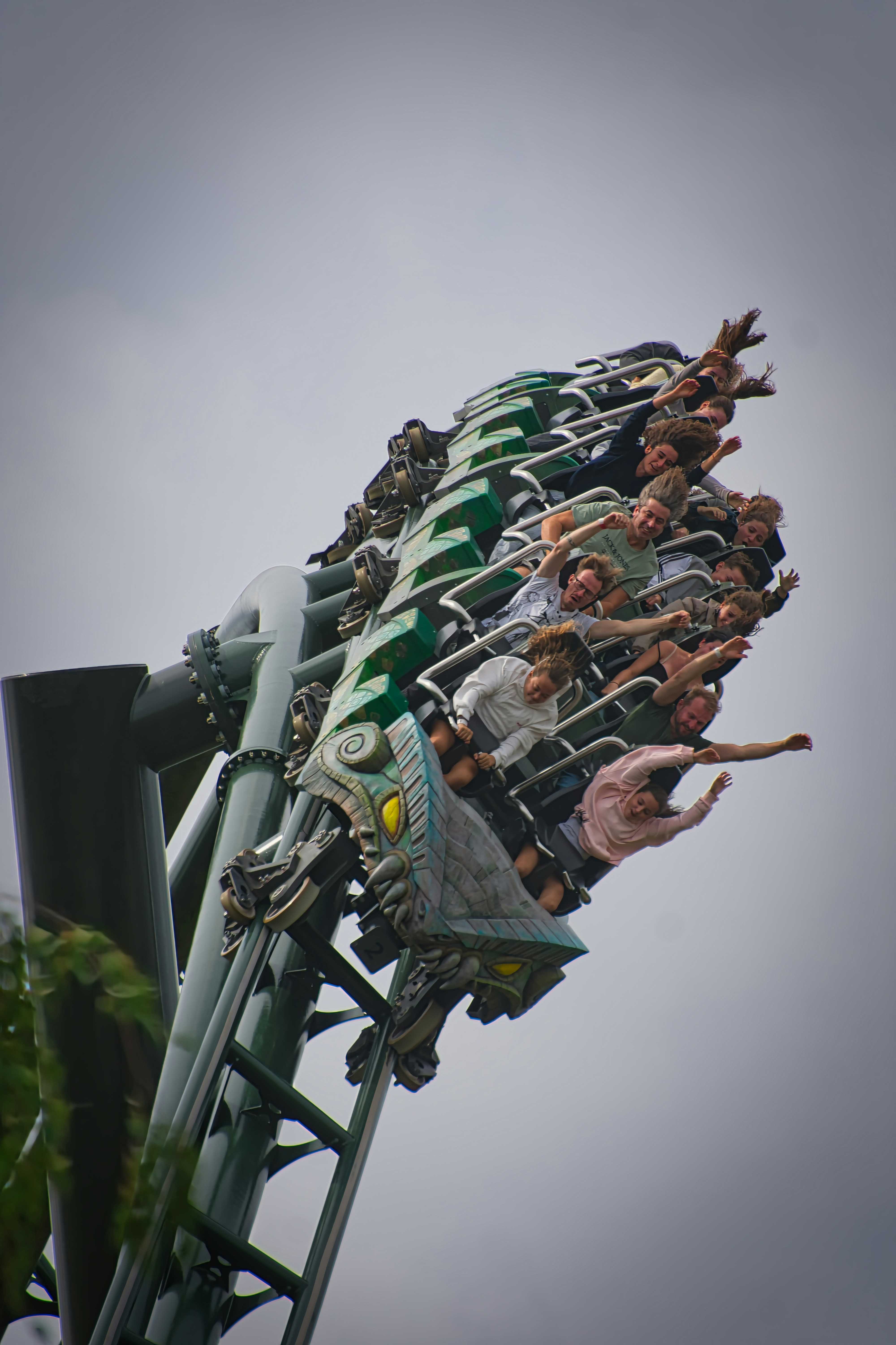 Over the Edge: A Line of Riders on a Tilted Thrill