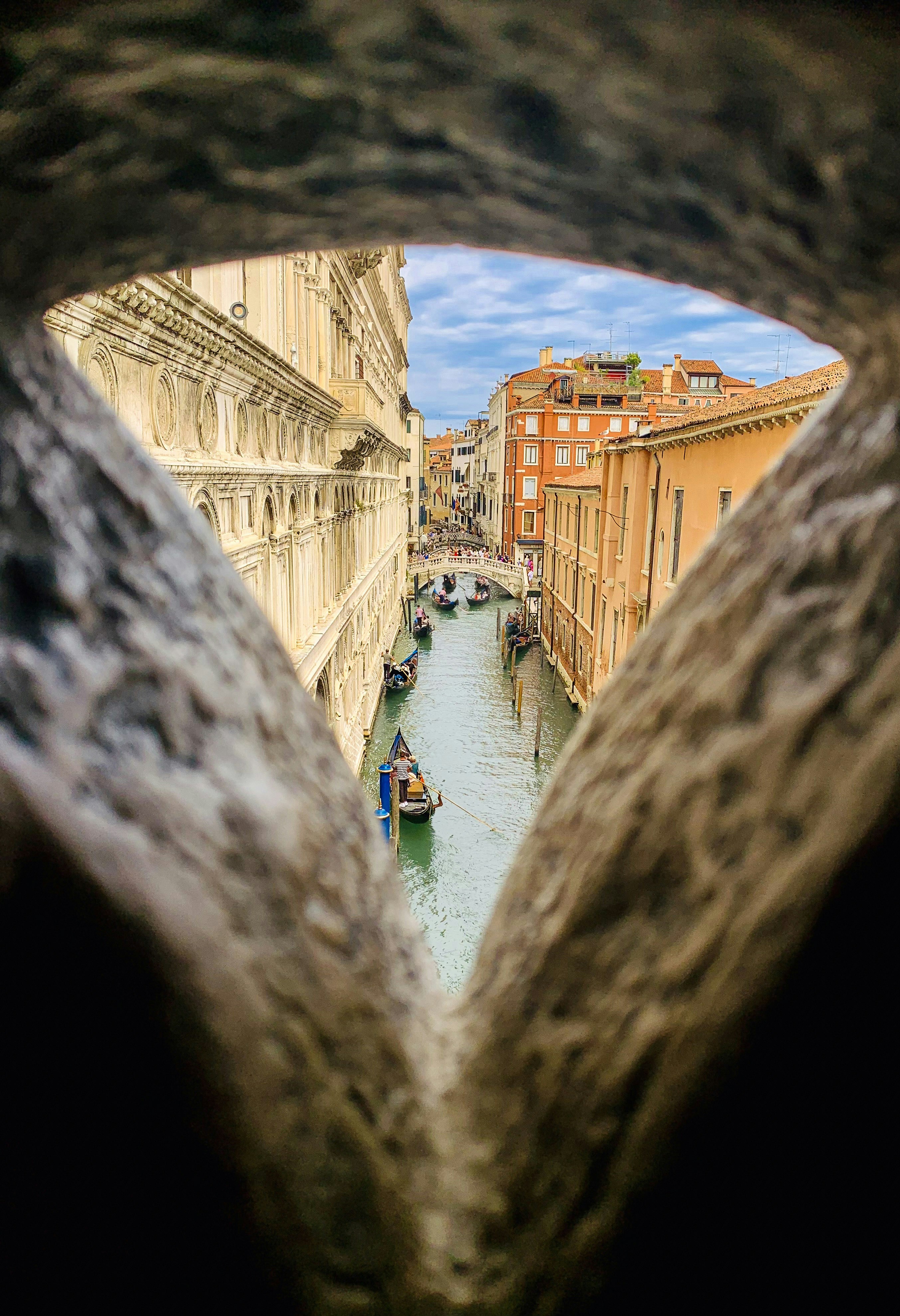 Through the Stone Slit: Canal View Framed by a Historic Aperture