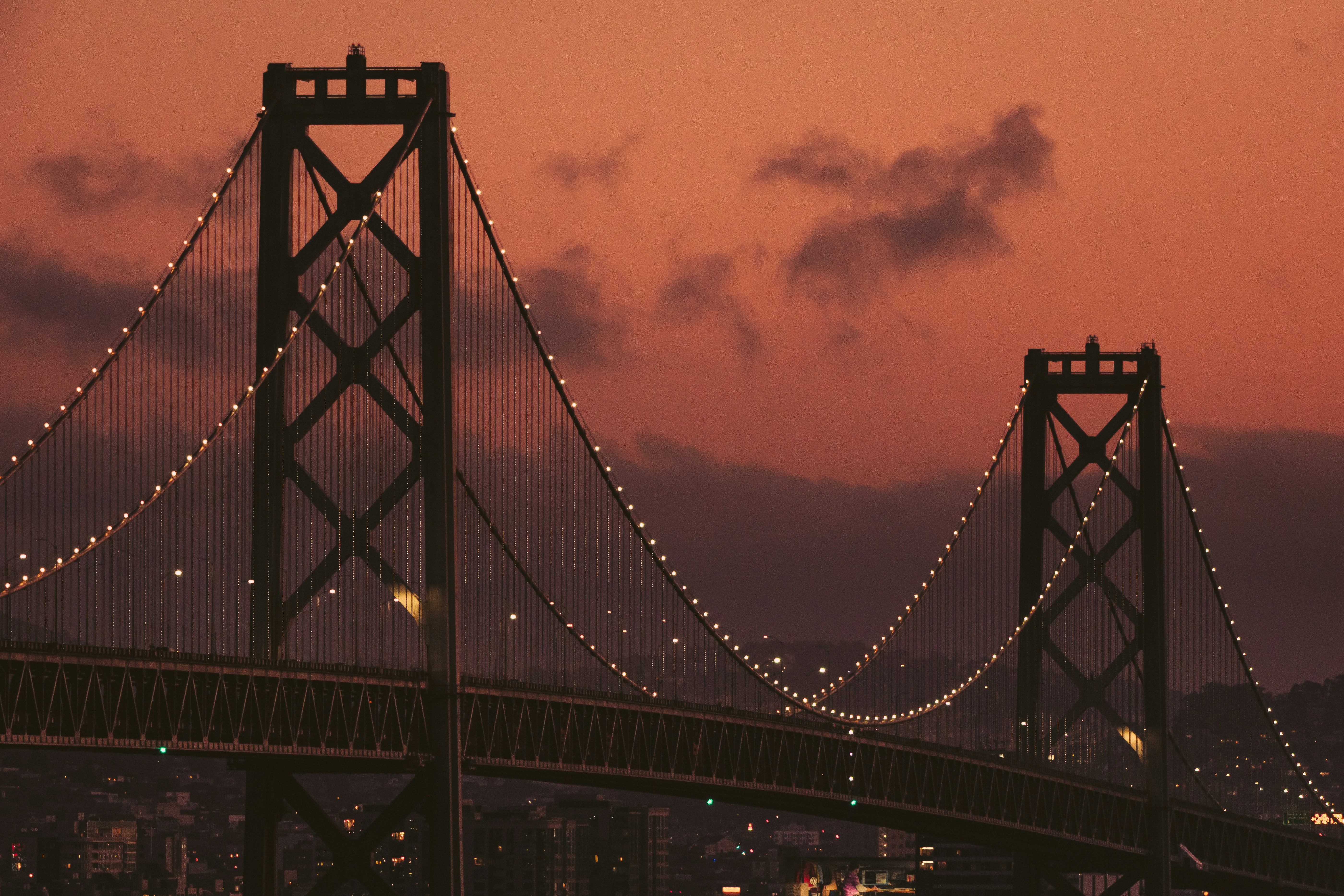 Twilight Span: A City-Hugging Bridge at Dusk