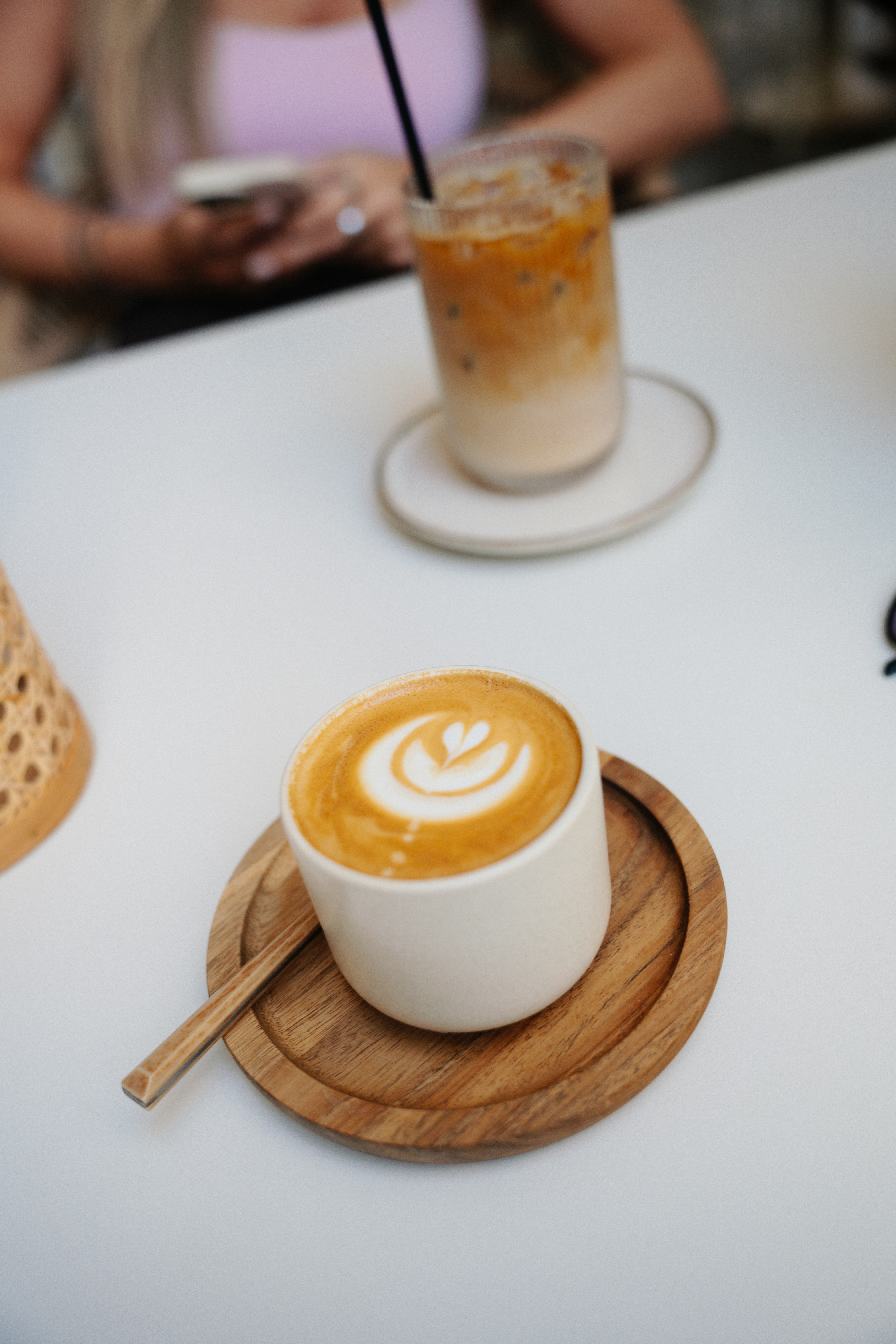  Latte Art at the Cozy Café: A White Cup on a Wooden Saucer