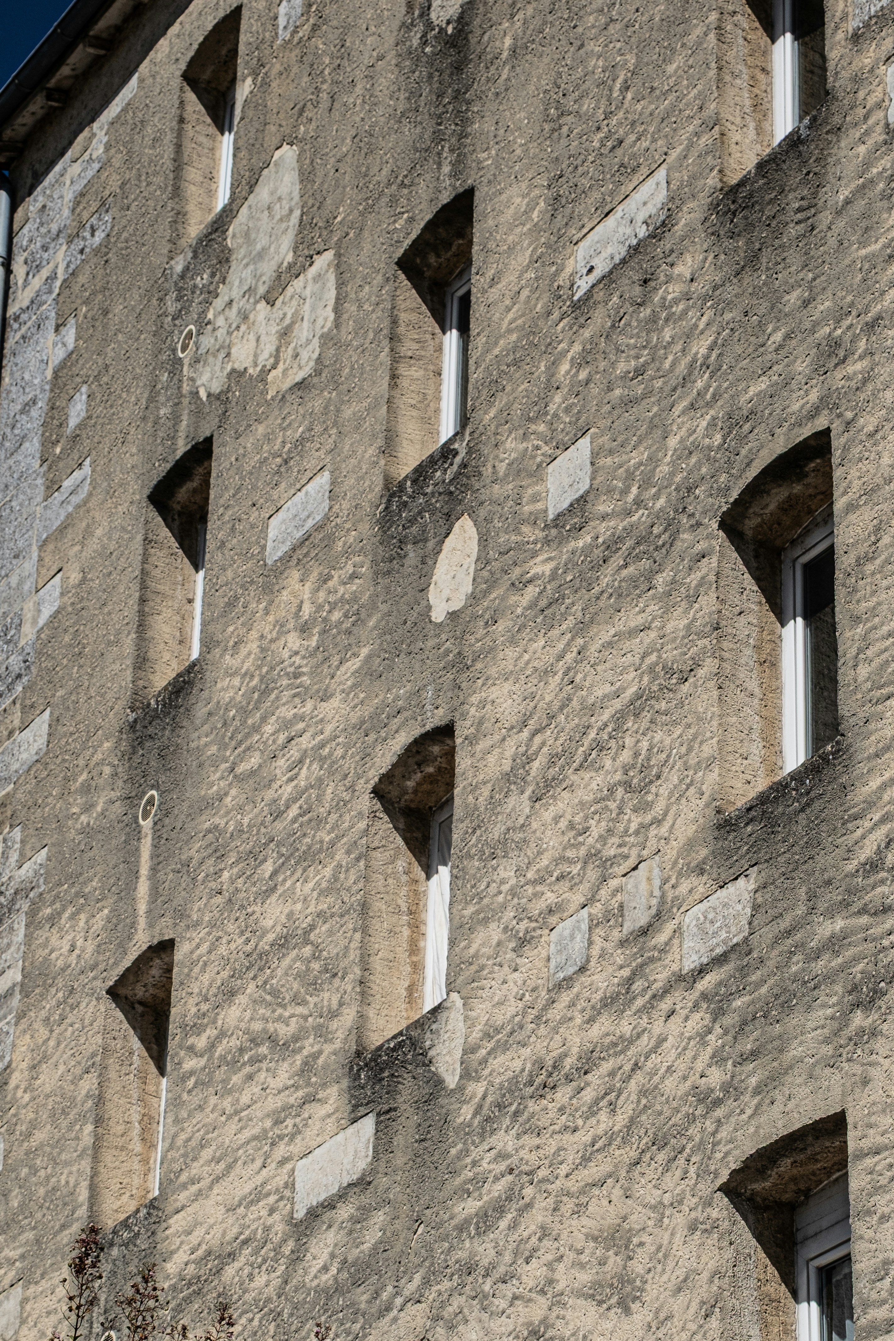 Stone Facade with Receding Windows