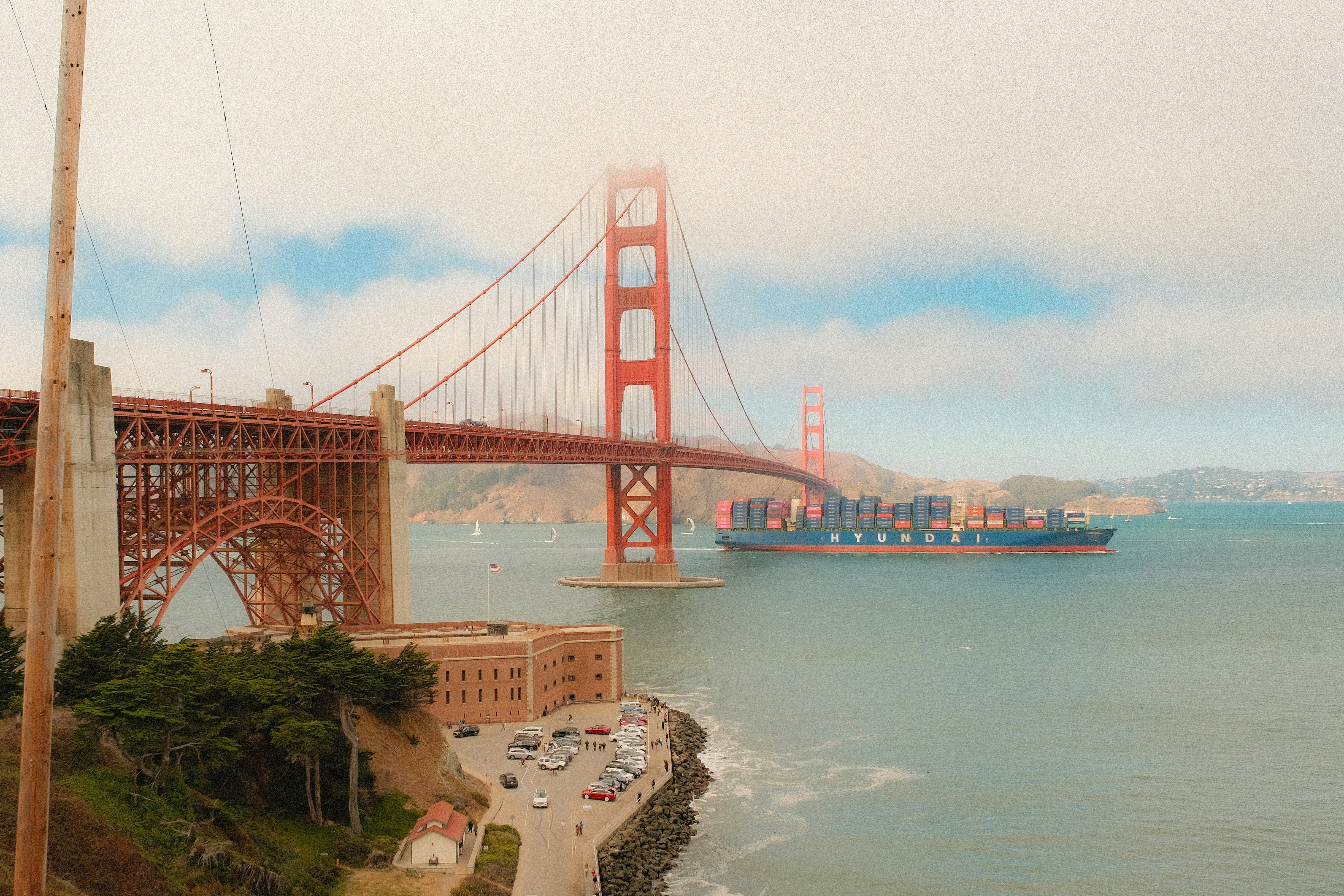 Tender Fjord Passage: The Red Span Over Calm Waters