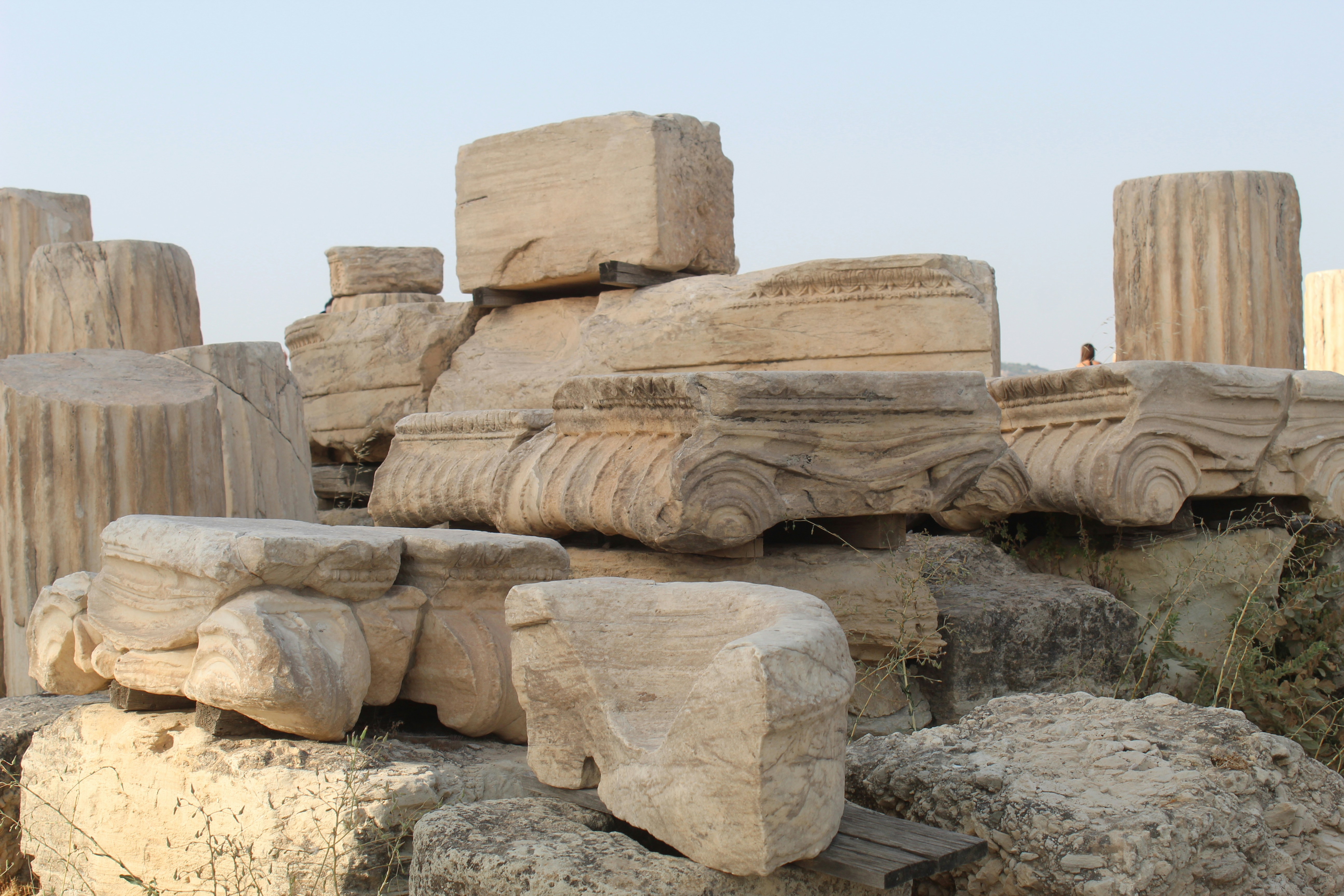 Weathered Carvings: Sunlit Fragments of Ancient Stoneware