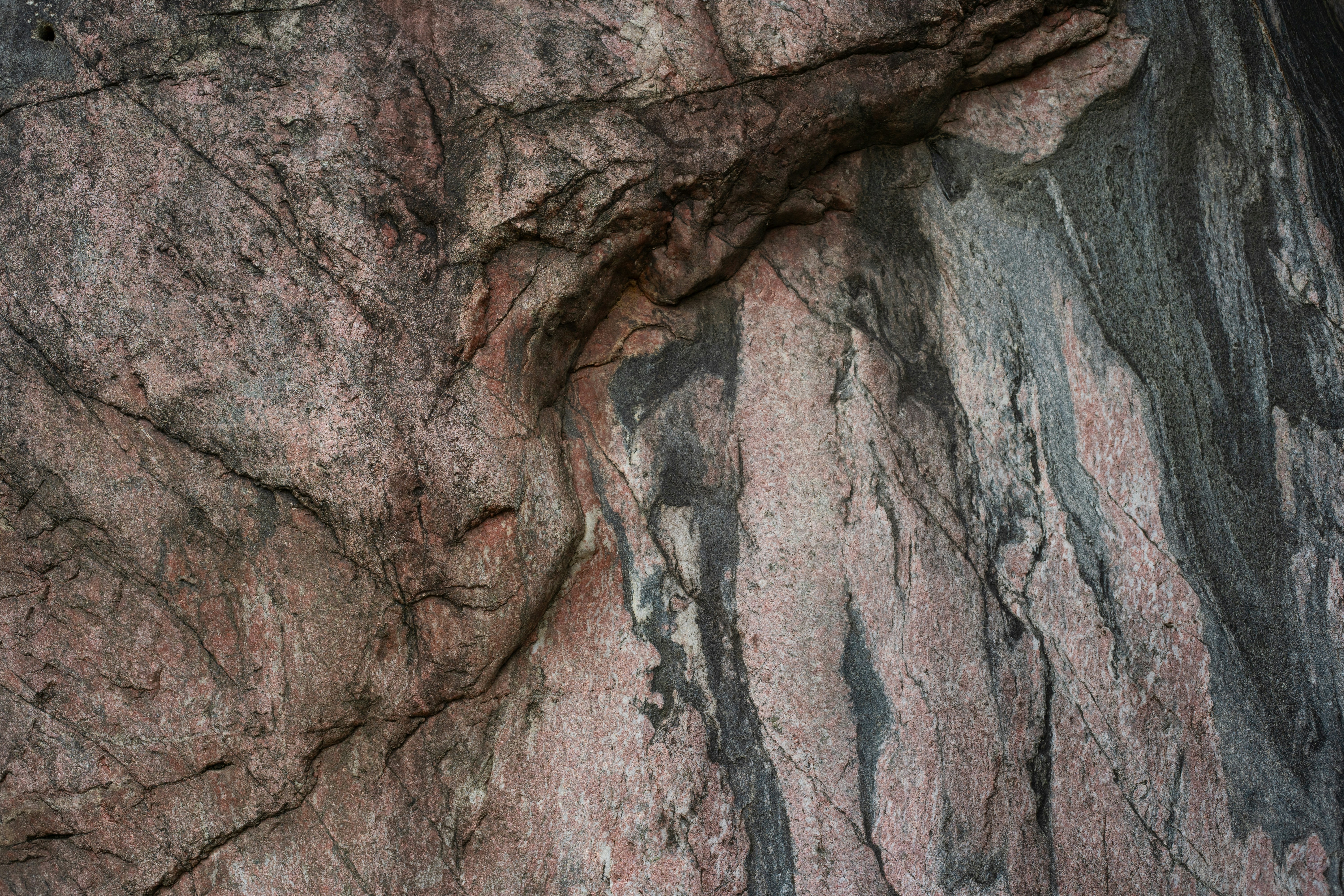 Weathered Strata: A Close-Up of Stone Textures and Color Veins