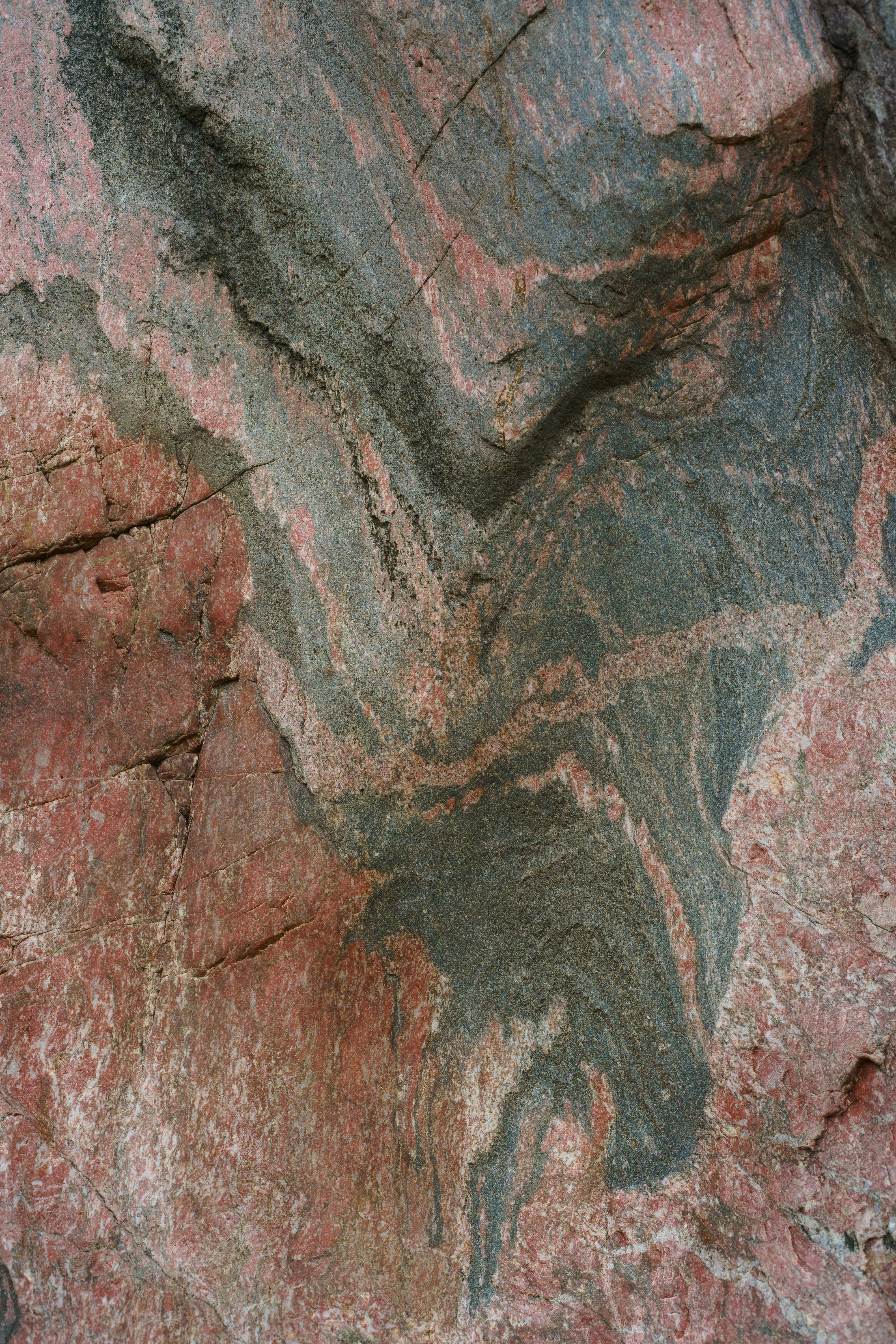 Swirling Sedimentary Veins in Painted Stone
