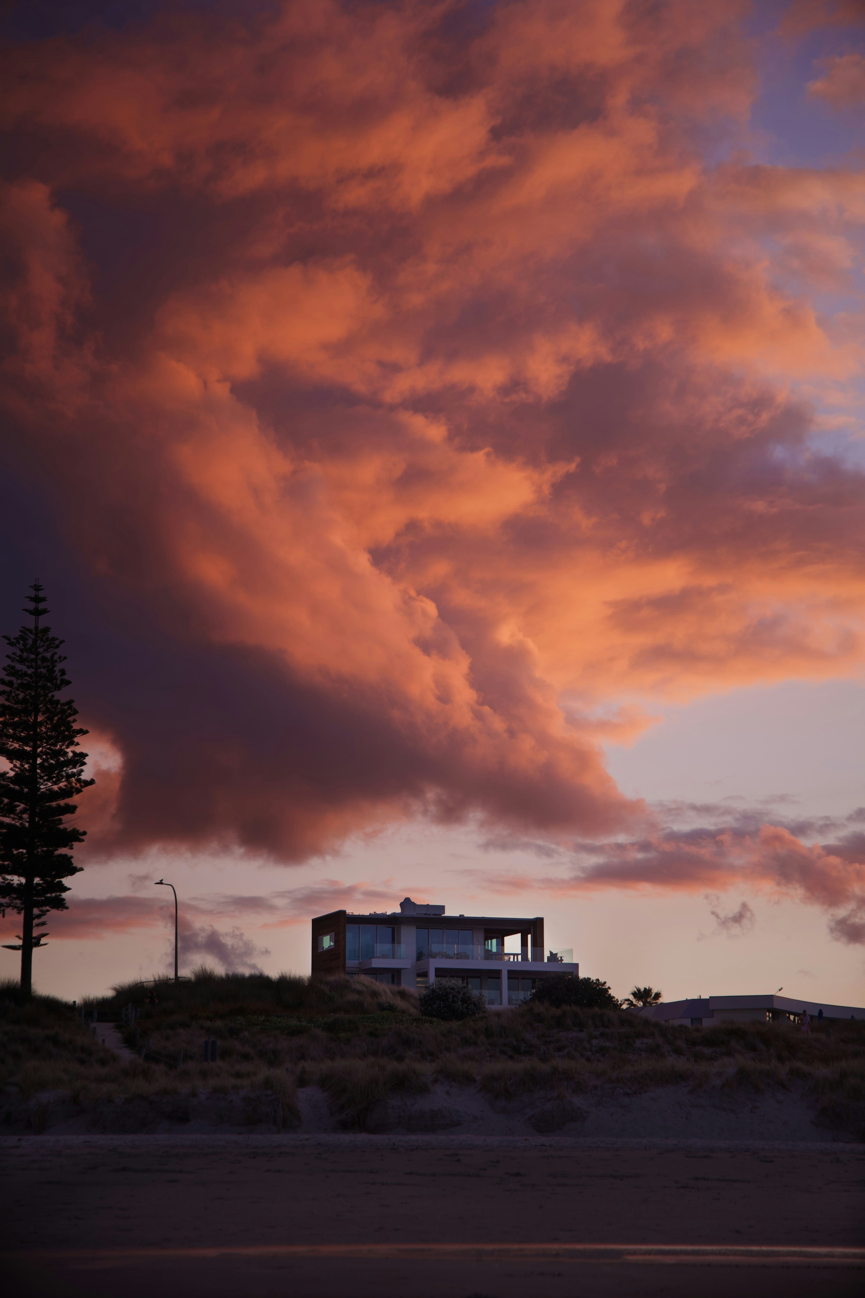 Crimson Clouds Over a Quiet Dune House