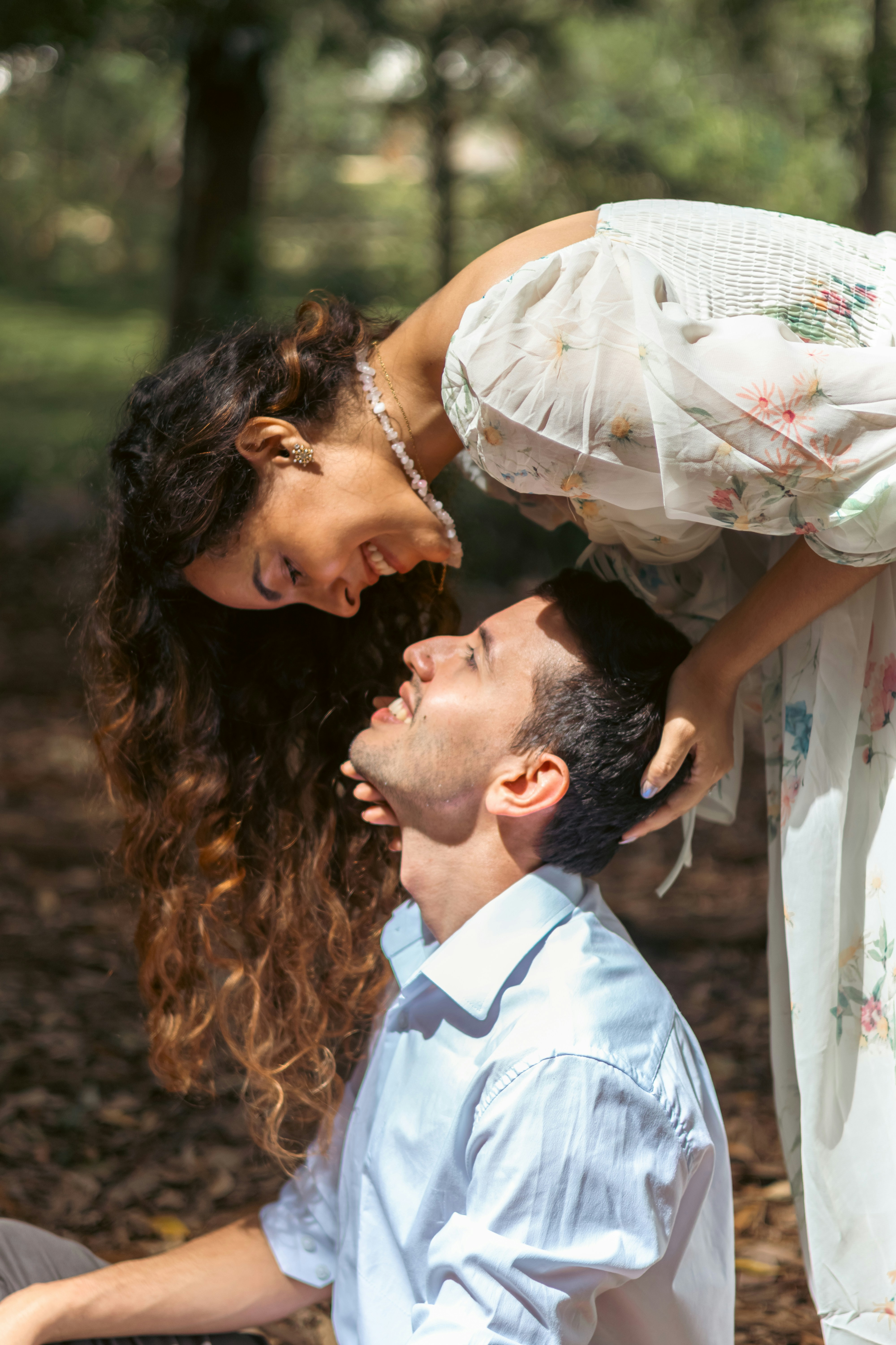 Upside-Down Moment: A Gentle Embrace Under Dappled Park Light