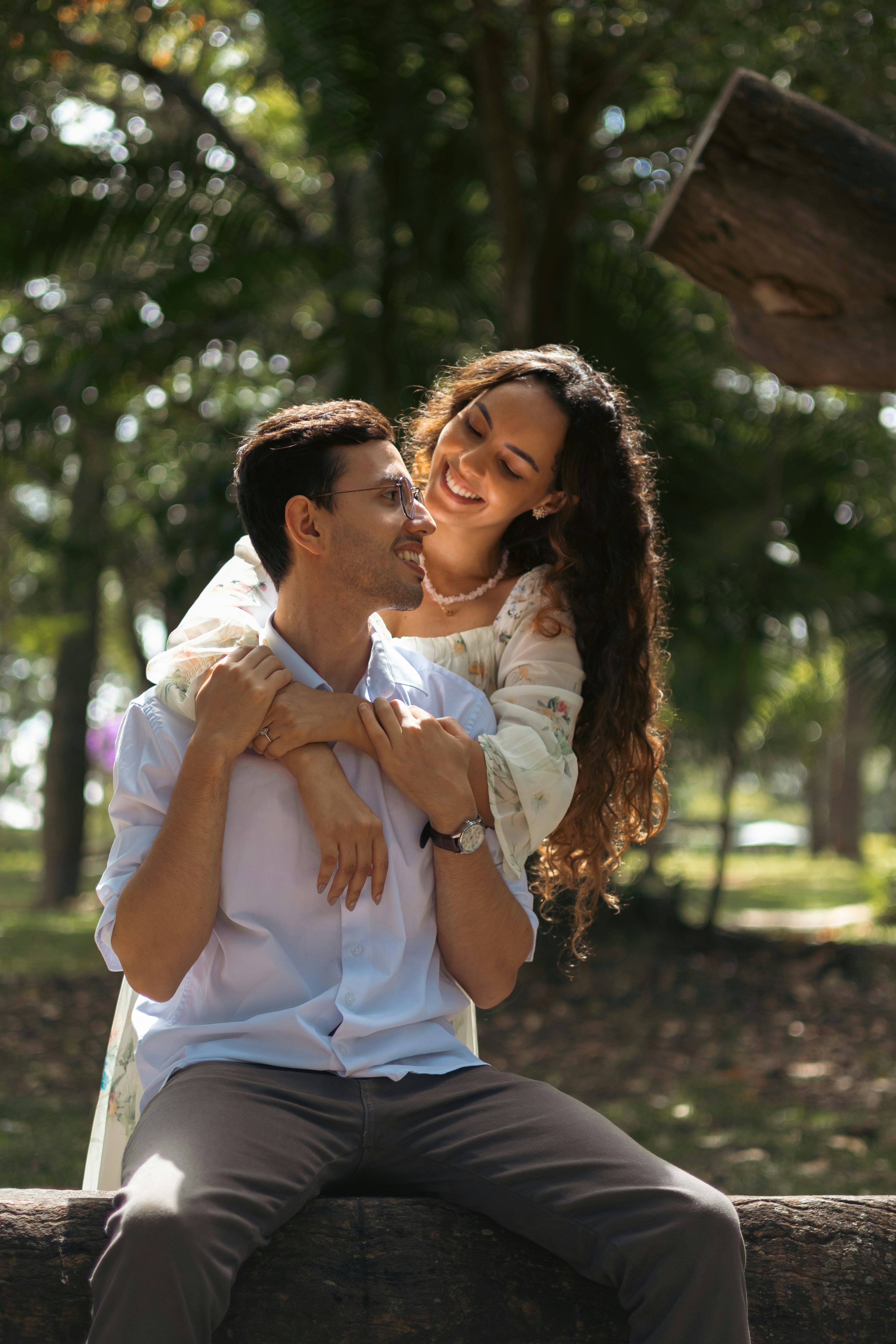 Close embrace under dappled sunshine