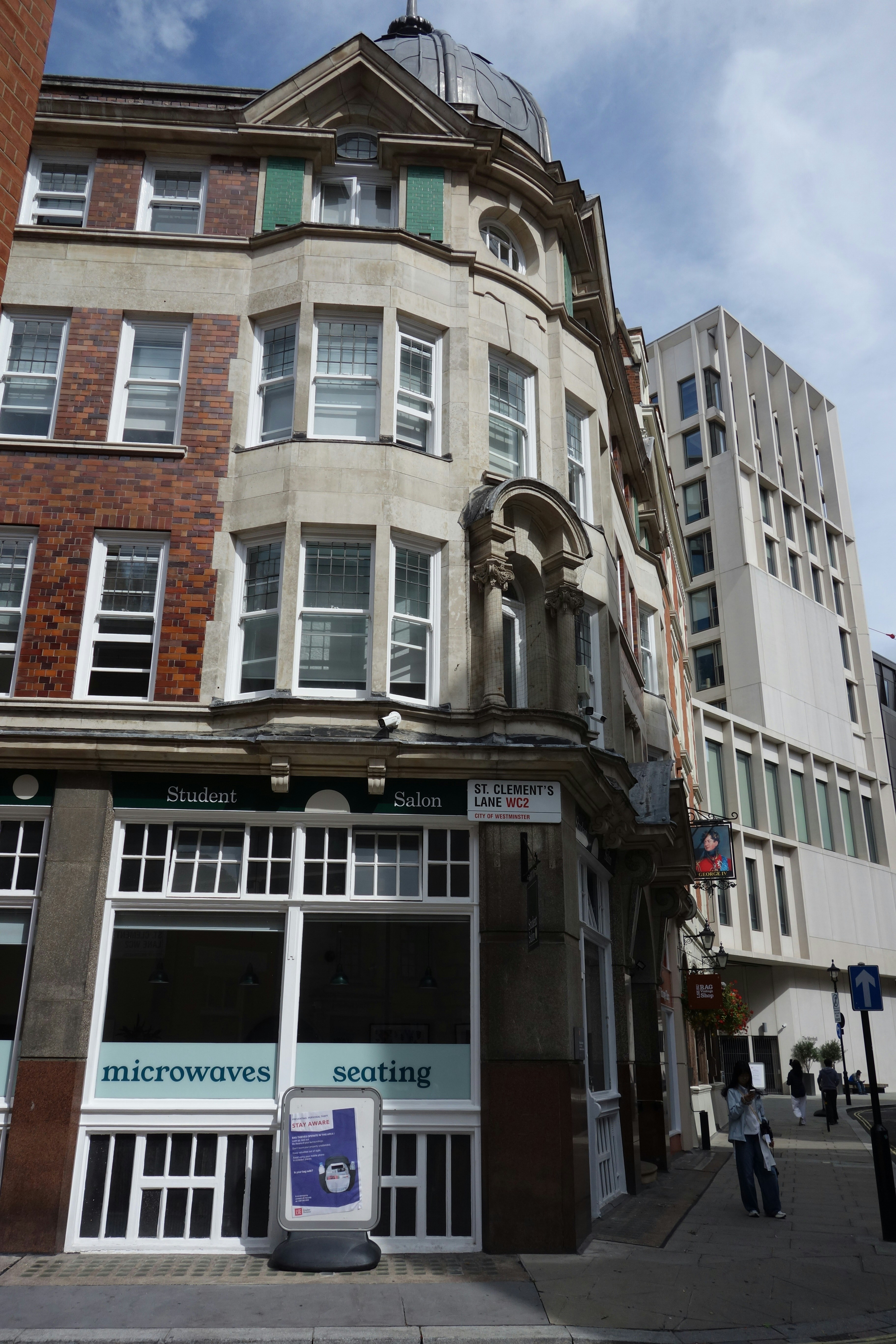 Cornerstone of Scooped Facades: A City Corner With a Vintage Storefront