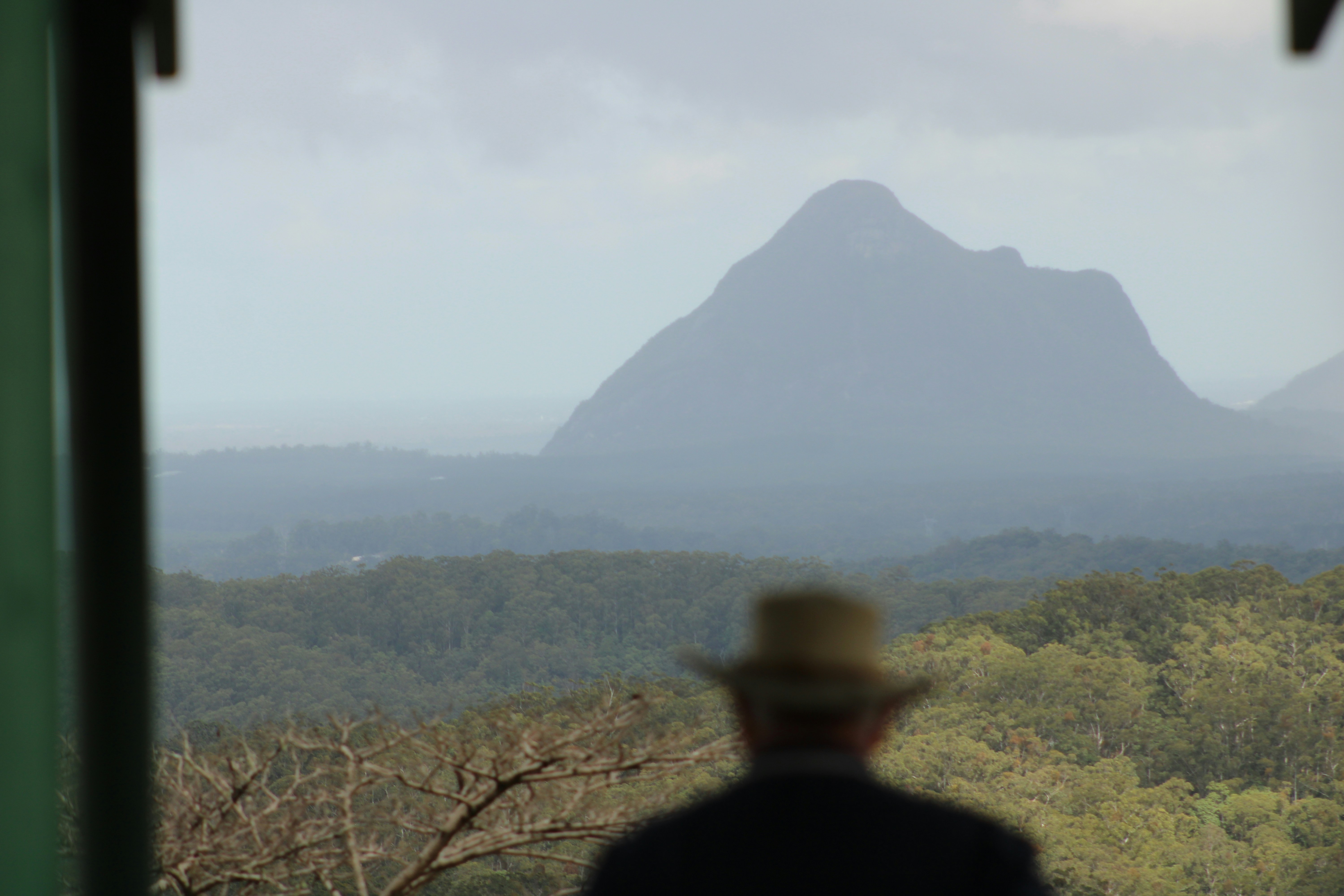 Vista Overlook: A Lone Figure Gazing at a Distant Peak