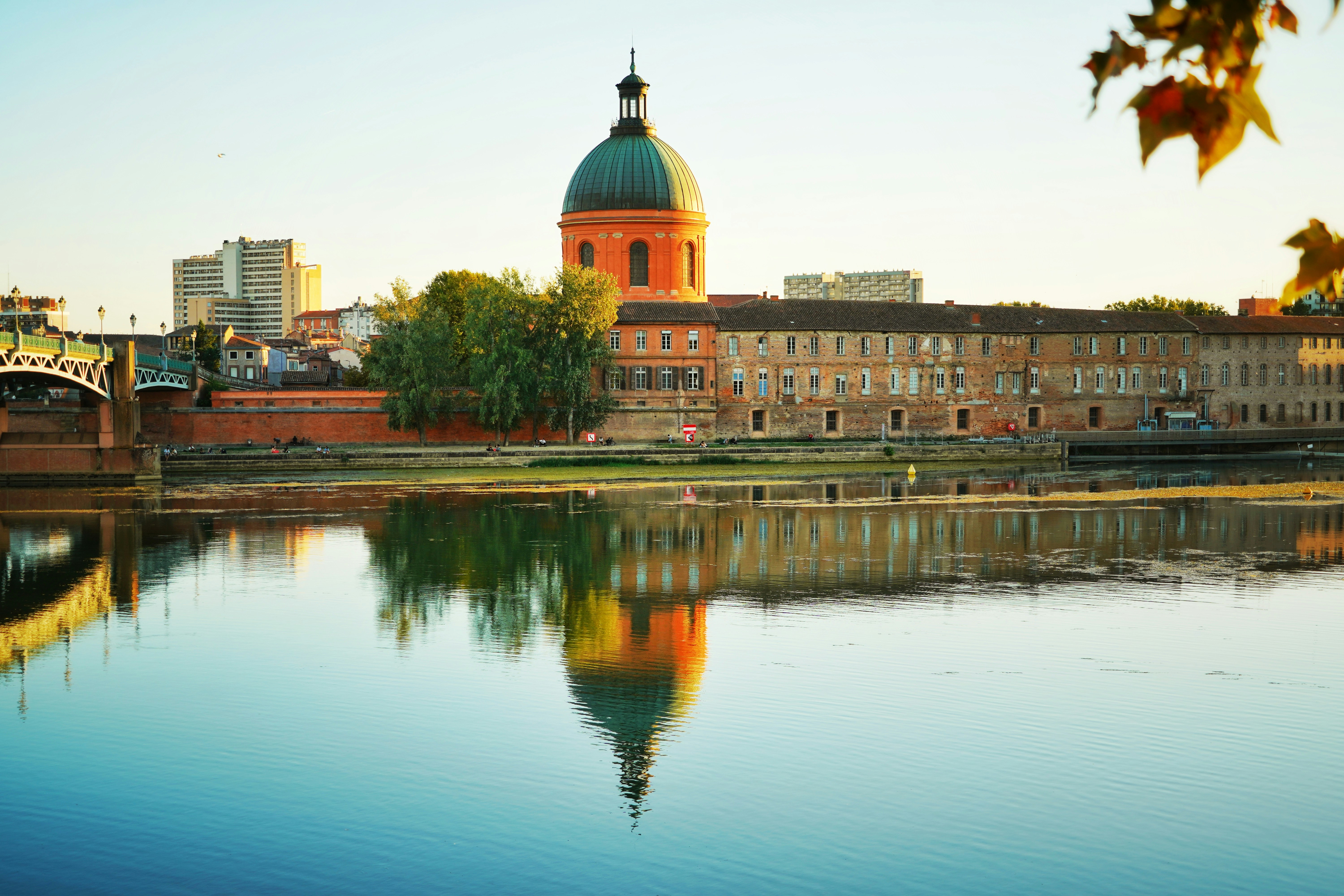 Stately Dome Over the River: A Cityscape in Quiet Reflection