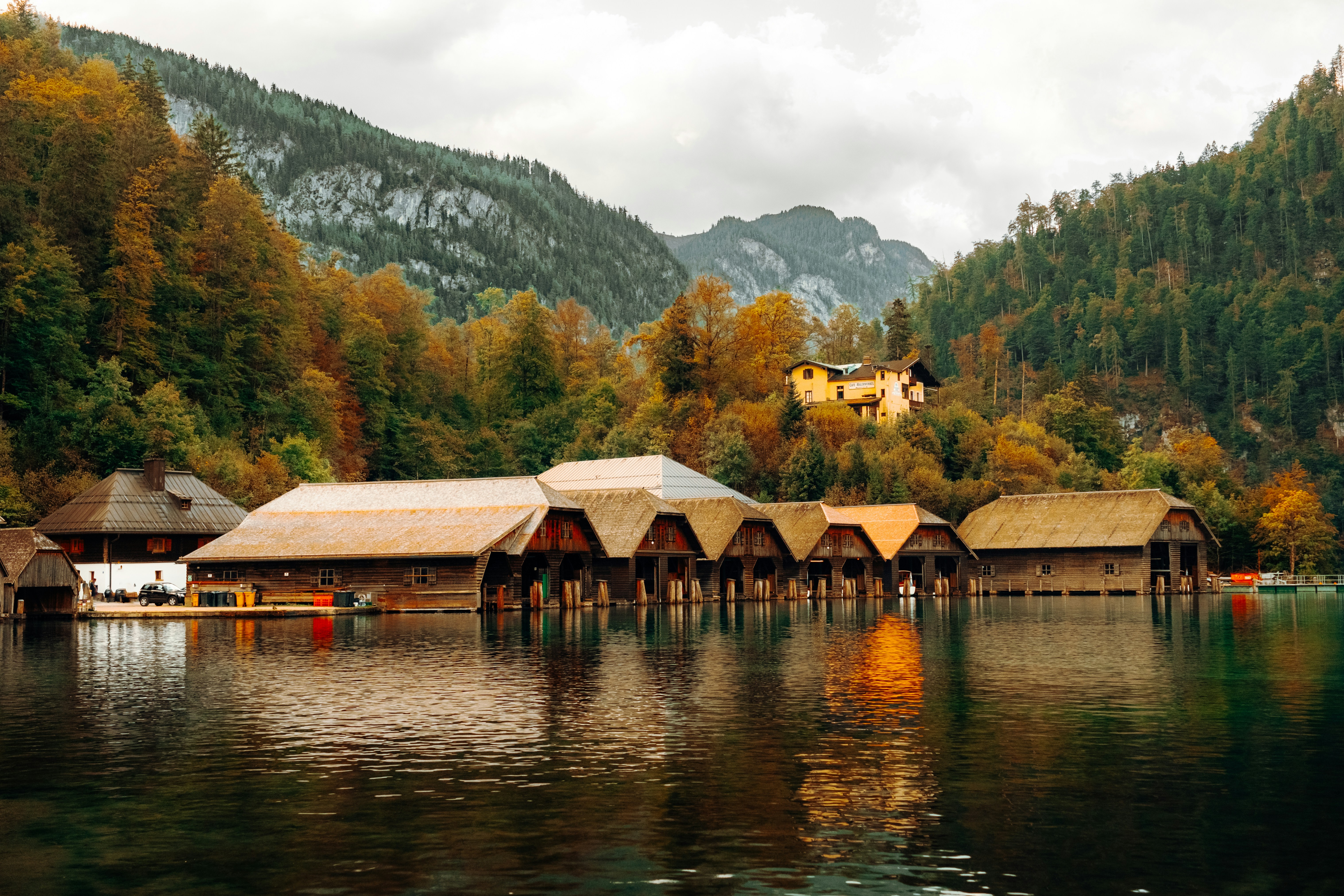 Boathouse Village at the Edge of a Autumn-Filled Lake