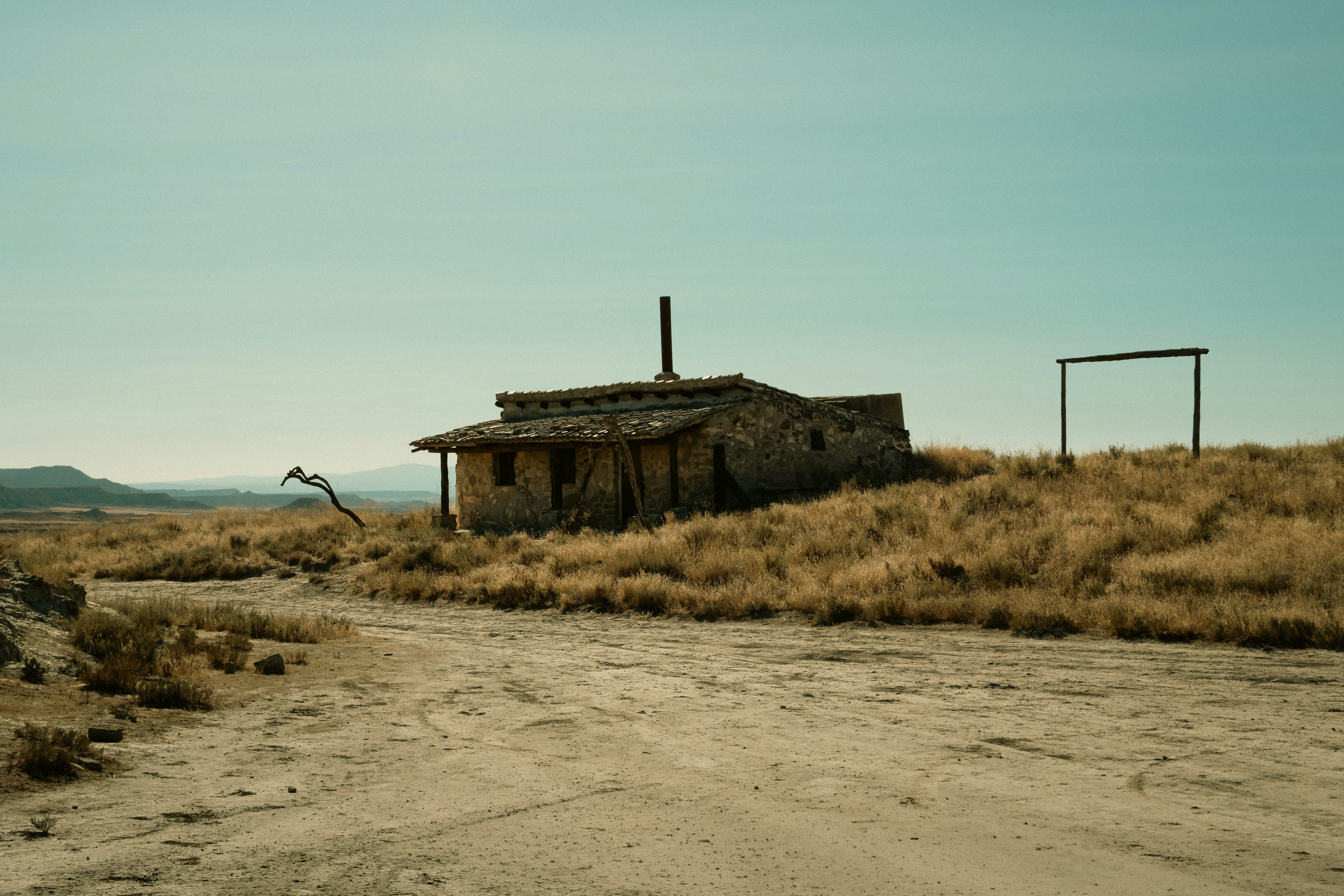 Deserted Shack at the Edge of Dried Fence Horizon