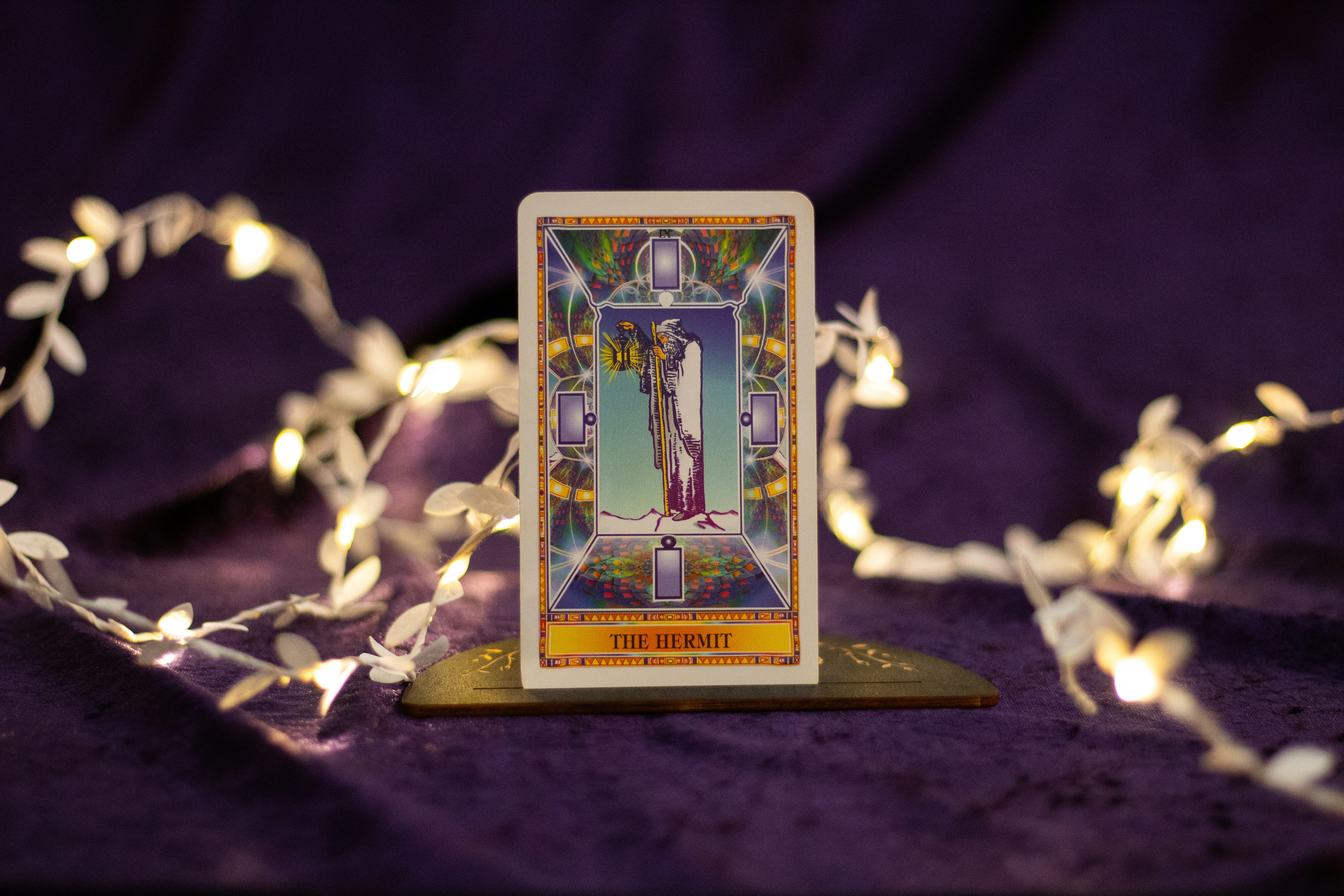The Hermit Card Anchored by Velvet Night and Fairy Lights