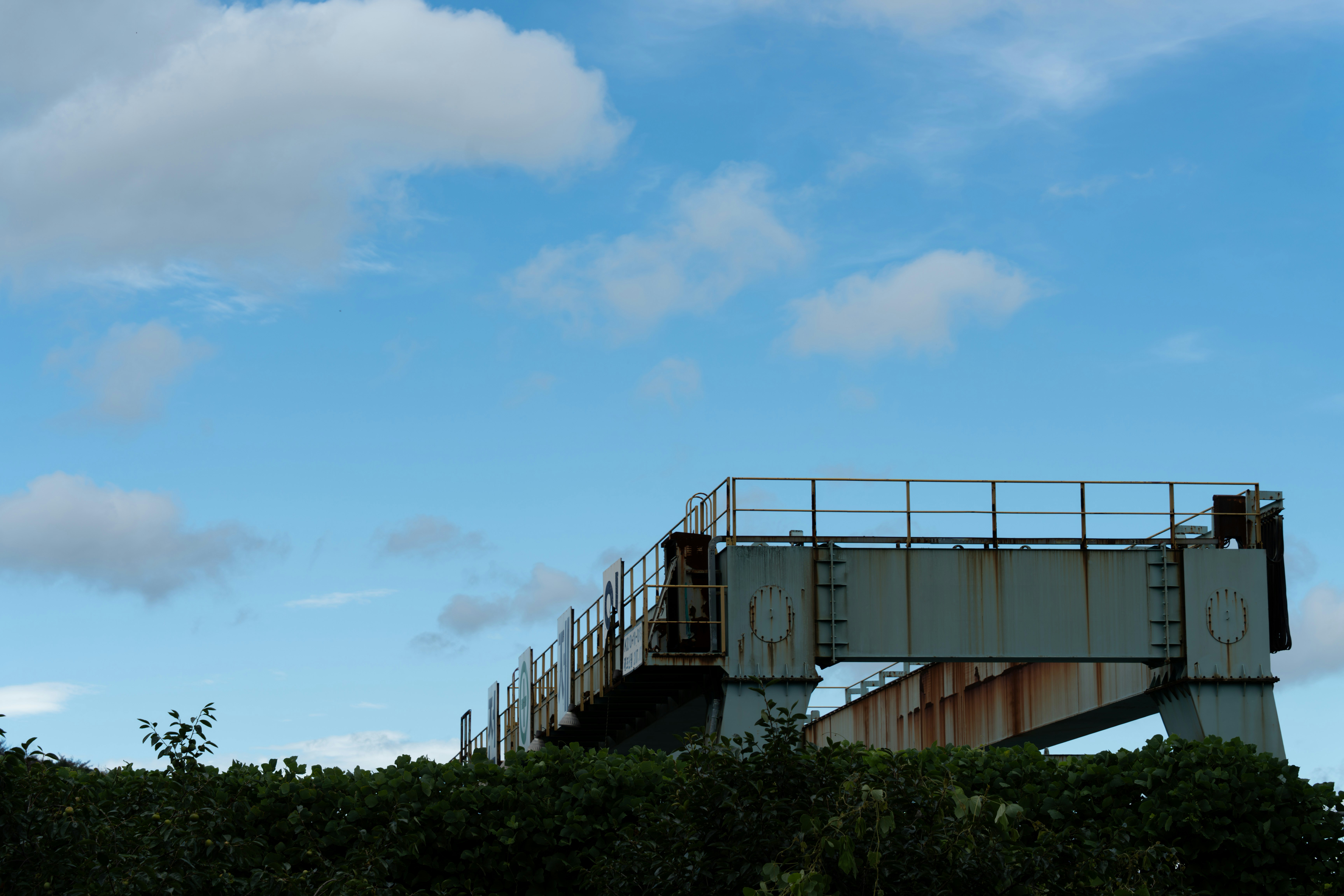 Rusted Walkway Crowned by Blue Sky