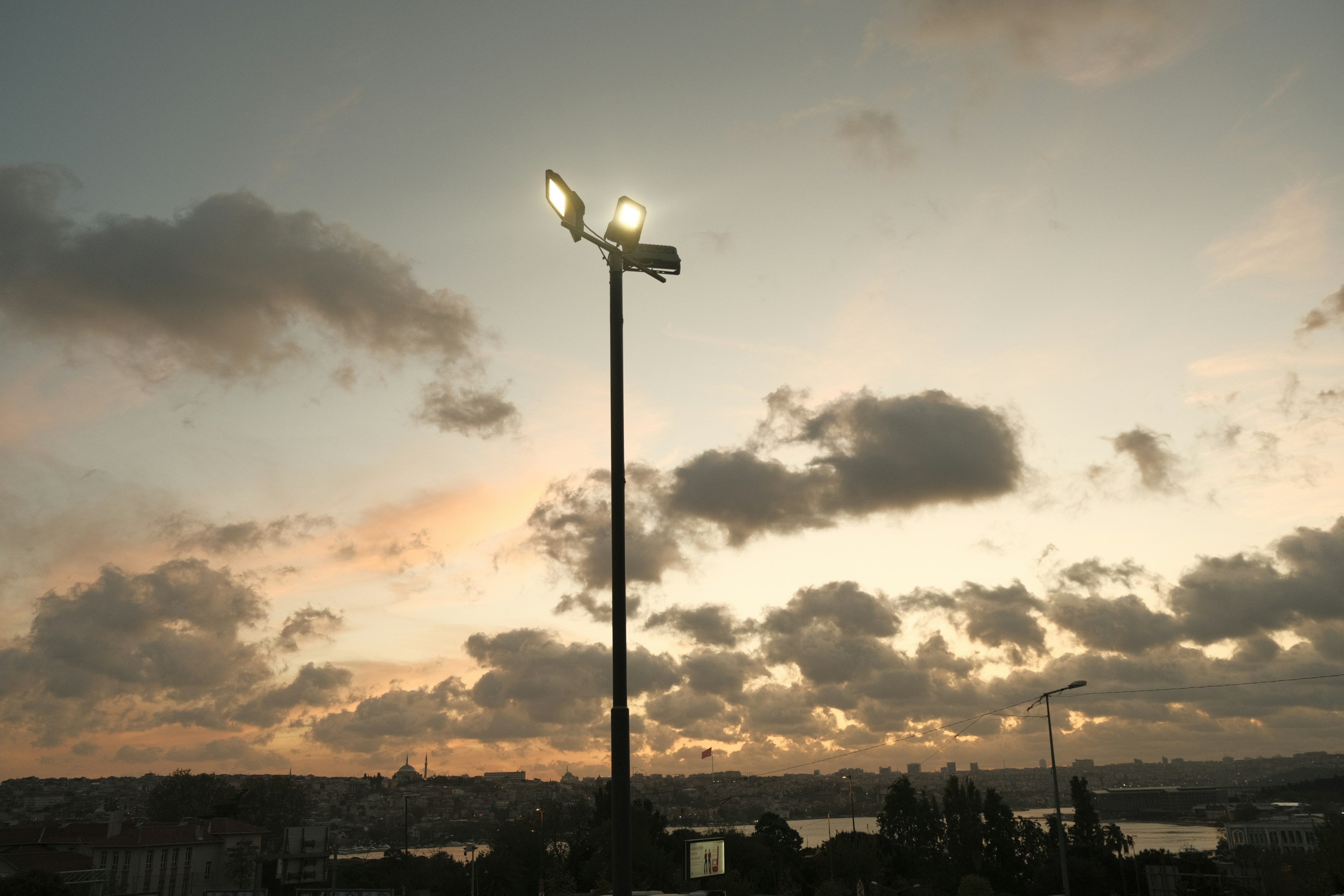 Rising Towers and Dusk-Soft Sky Over an Industrial Horizon