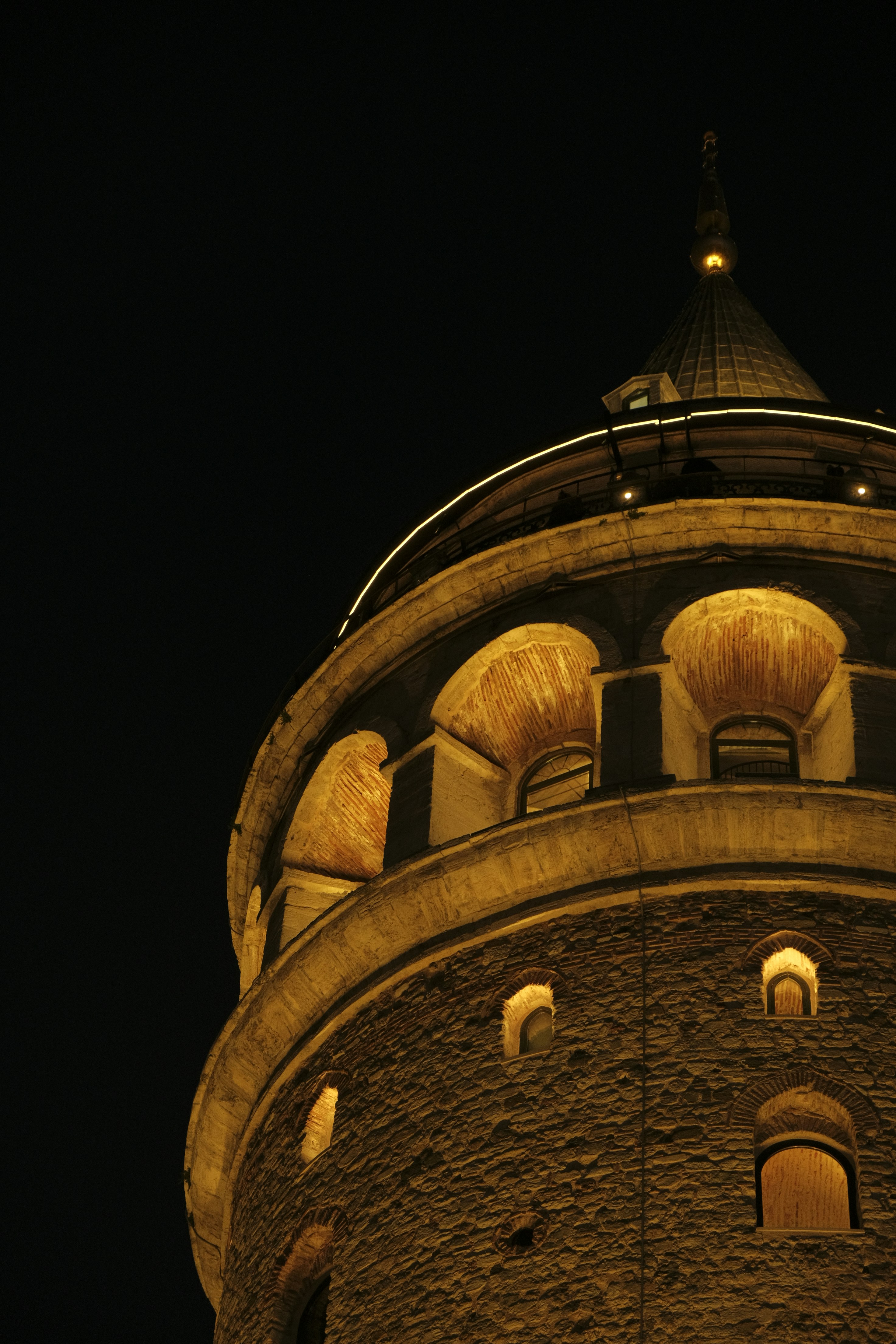 Nightfall at the Circular Turret: Warm Light on Stone Arches