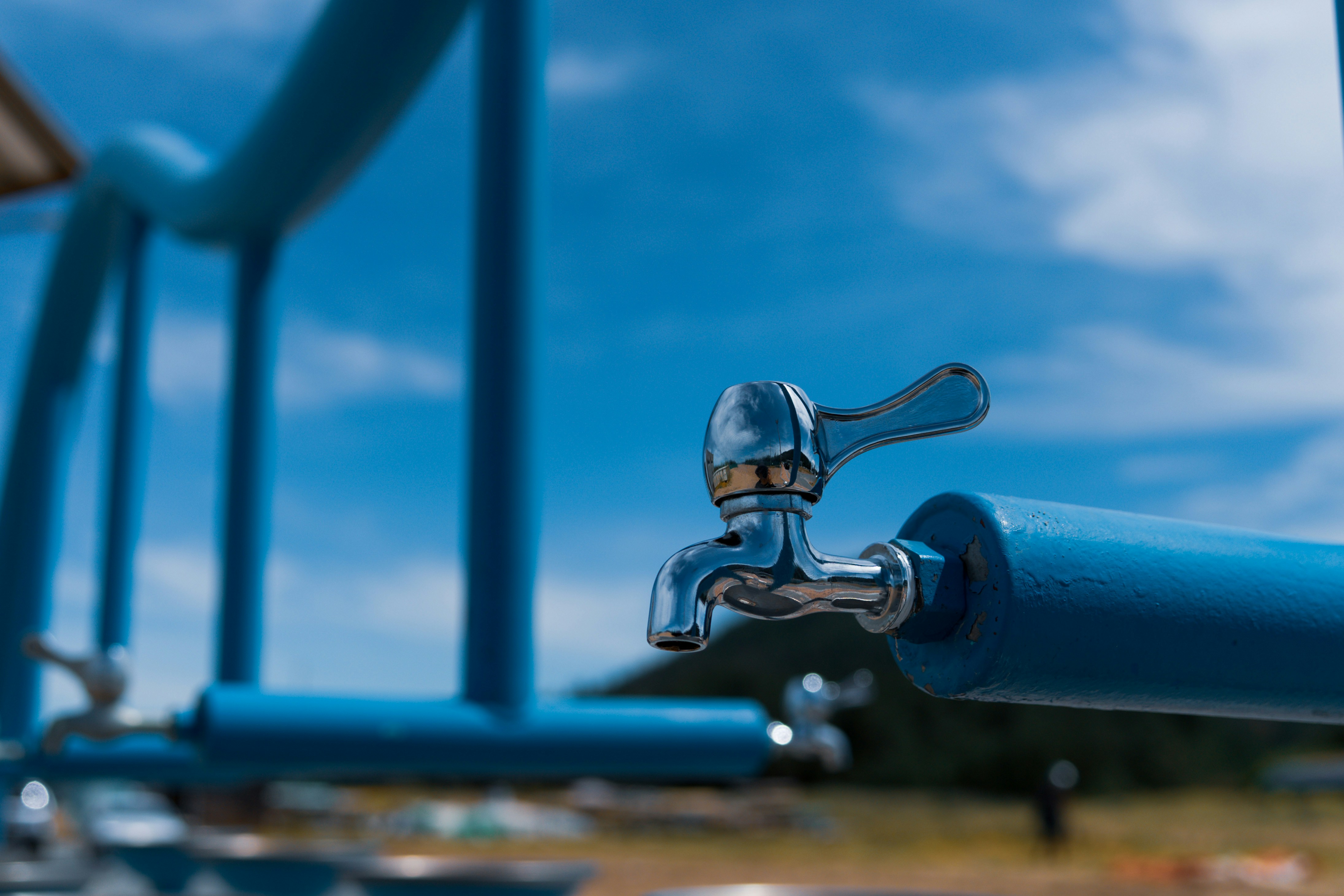 Blue Playground Faucet Still Life at Low Angle