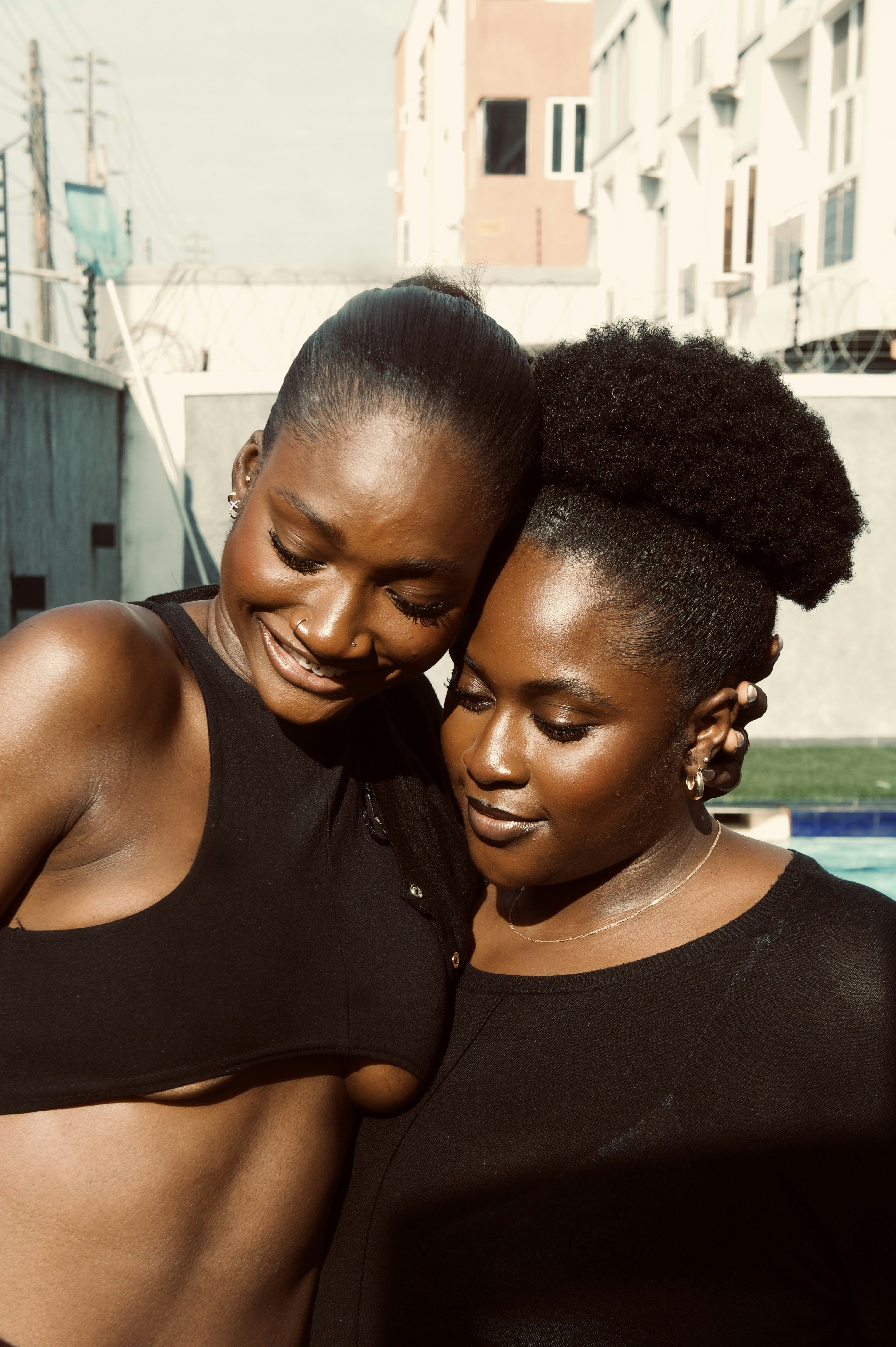 Two Close Friends, One Shared Moment in Bright Outdoor Light