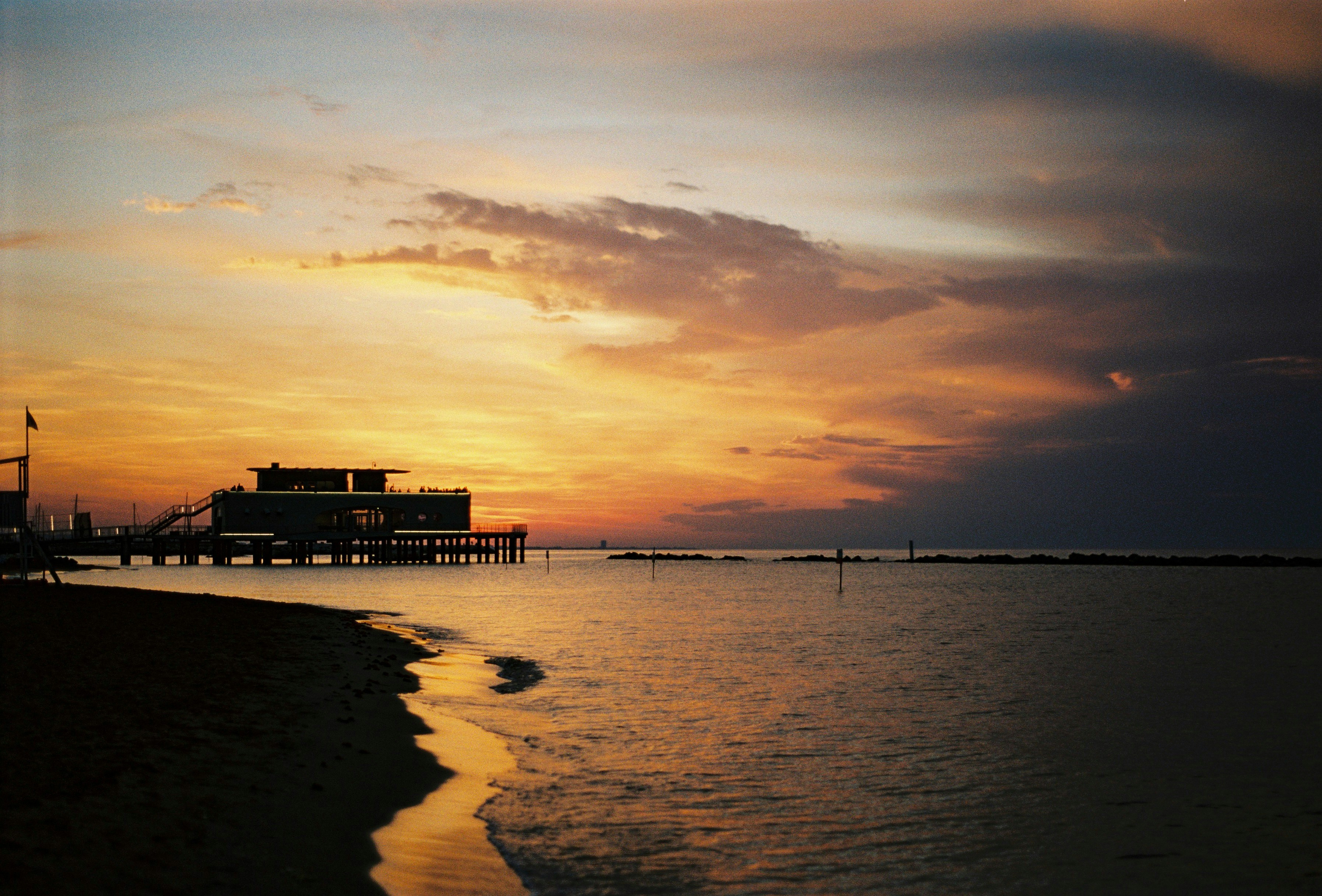 Sunset Pier: A Quiet Moment Over Tidal Light